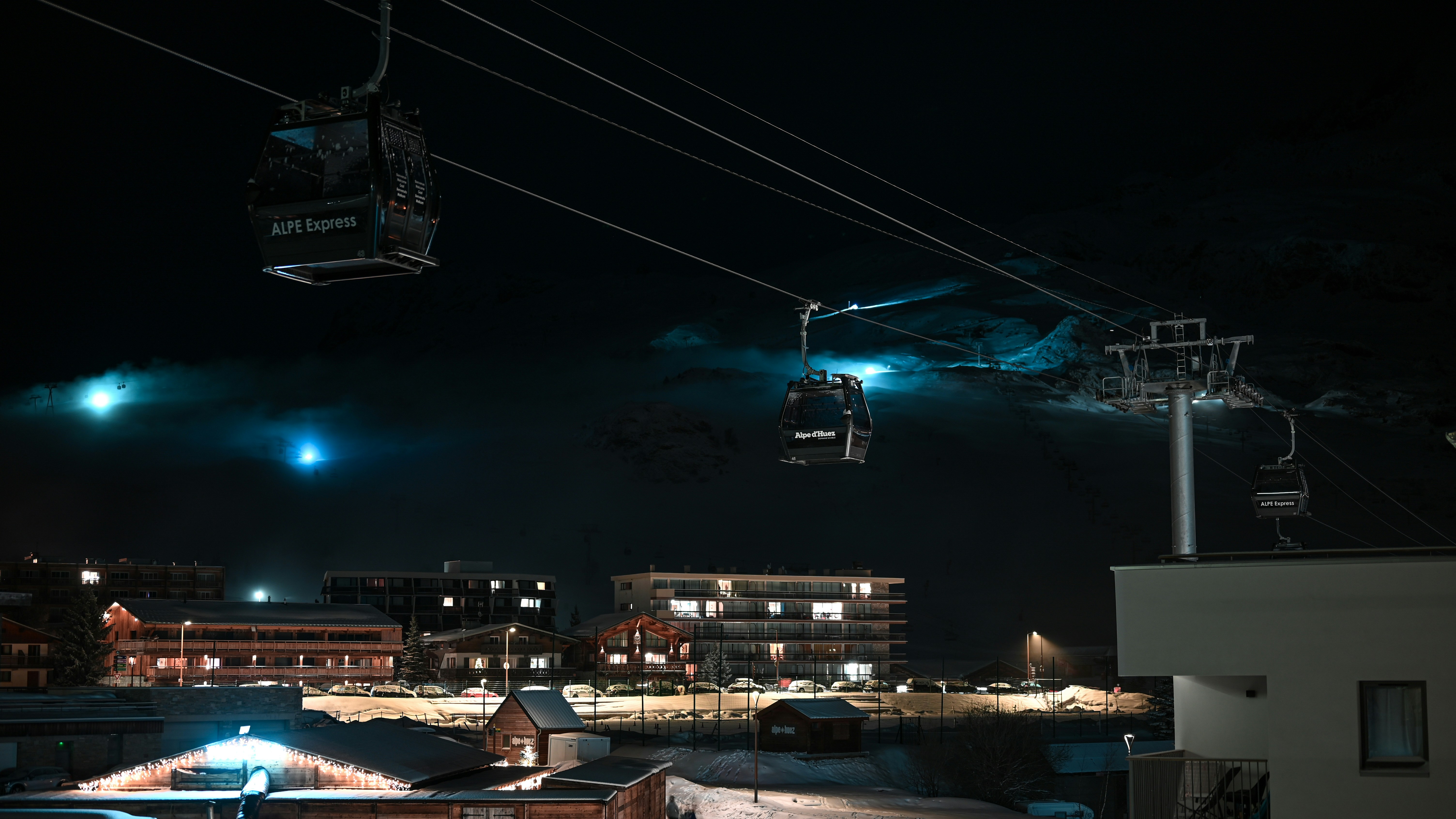 A ski lift going over a city at night photo – Free Nature Image on Unsplash