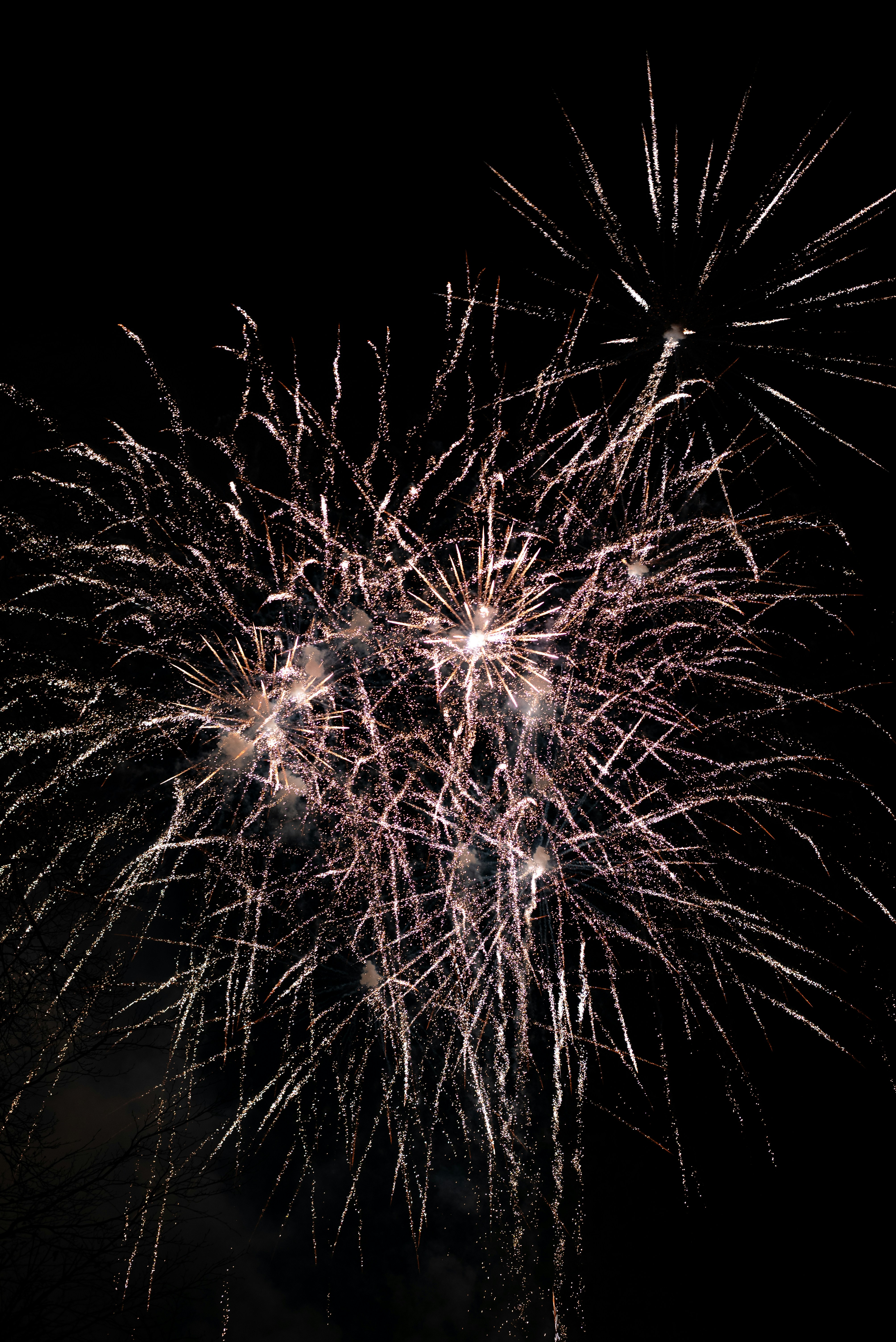 A bunch of fireworks are lit up in the night sky photo – Free ...