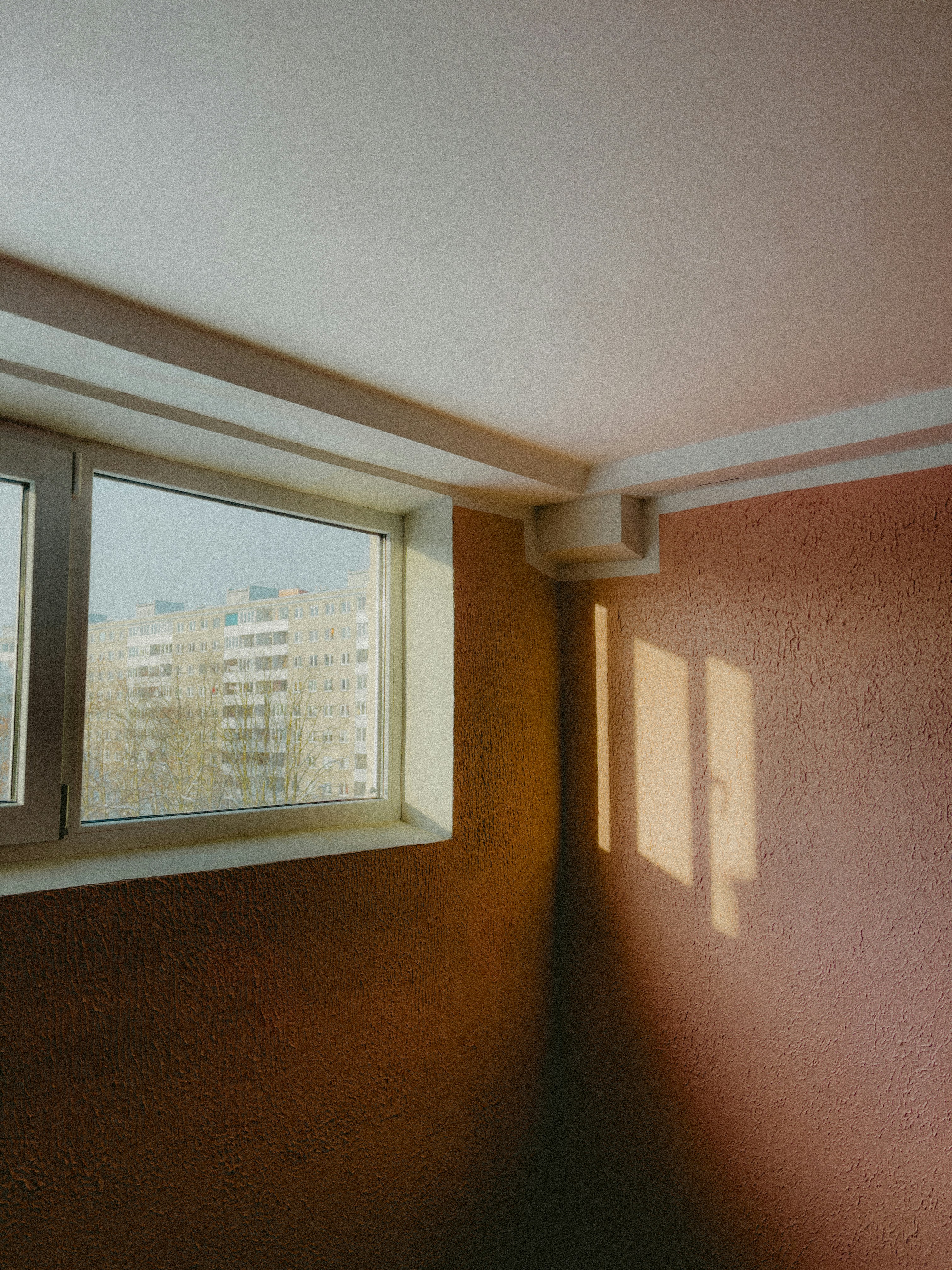 Window Light, Pink Corner: Quiet Geometry of Sunlit Walls