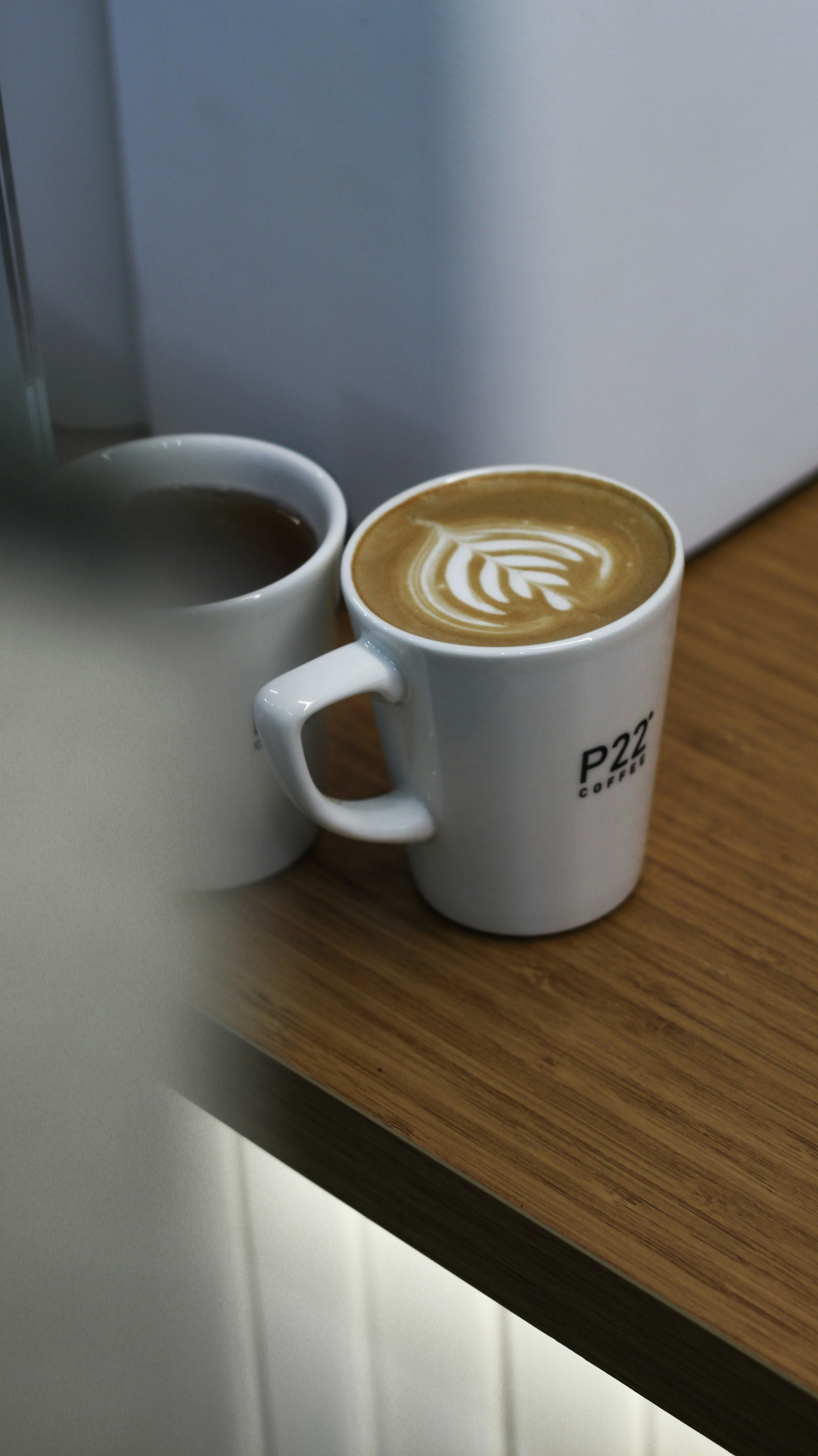 Swirl in the Spotlight: Latte Art Between White Mugs