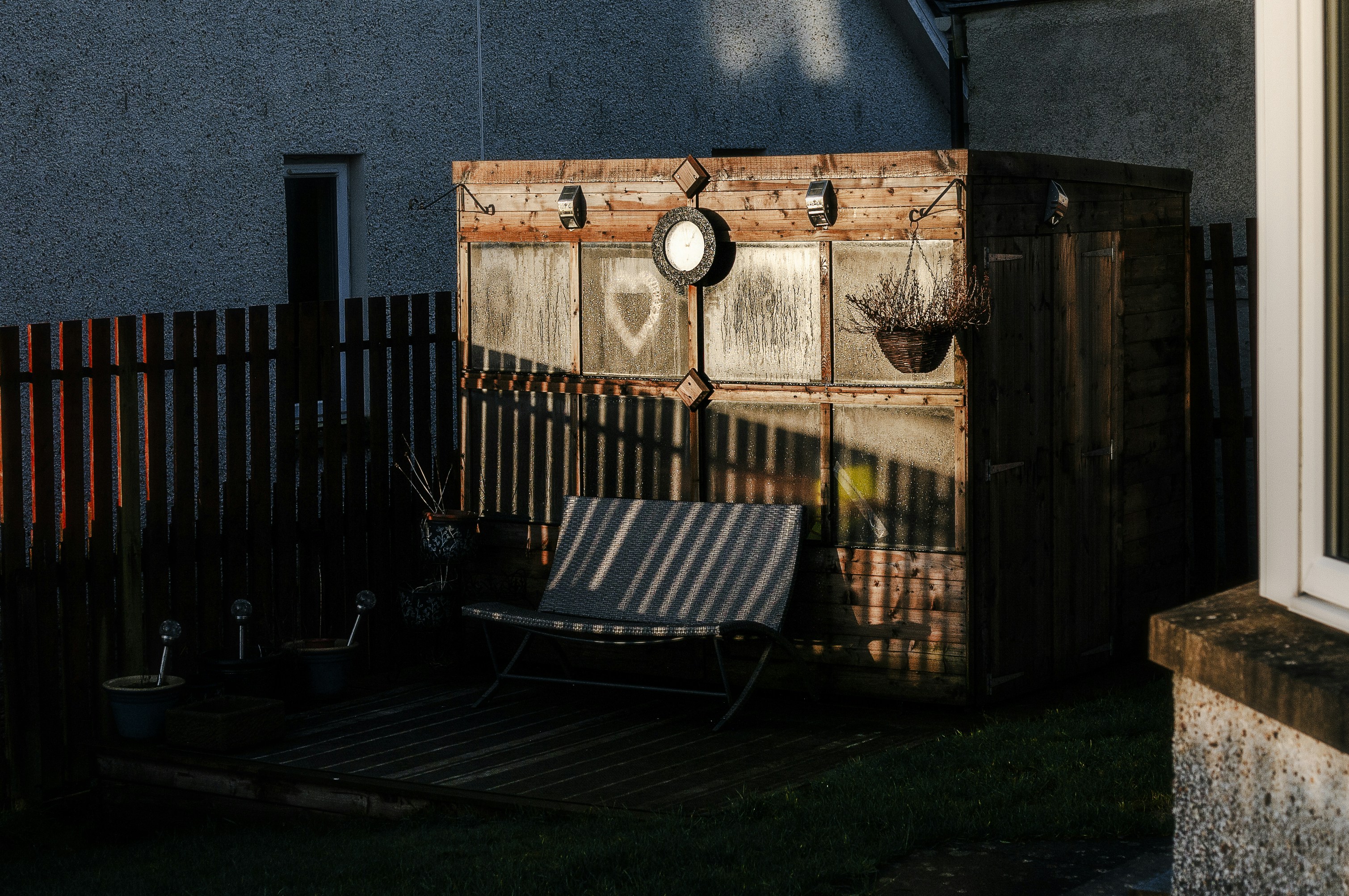 Clock on a Weathered Shed at Golden Hour: Quiet Backyard Portrait