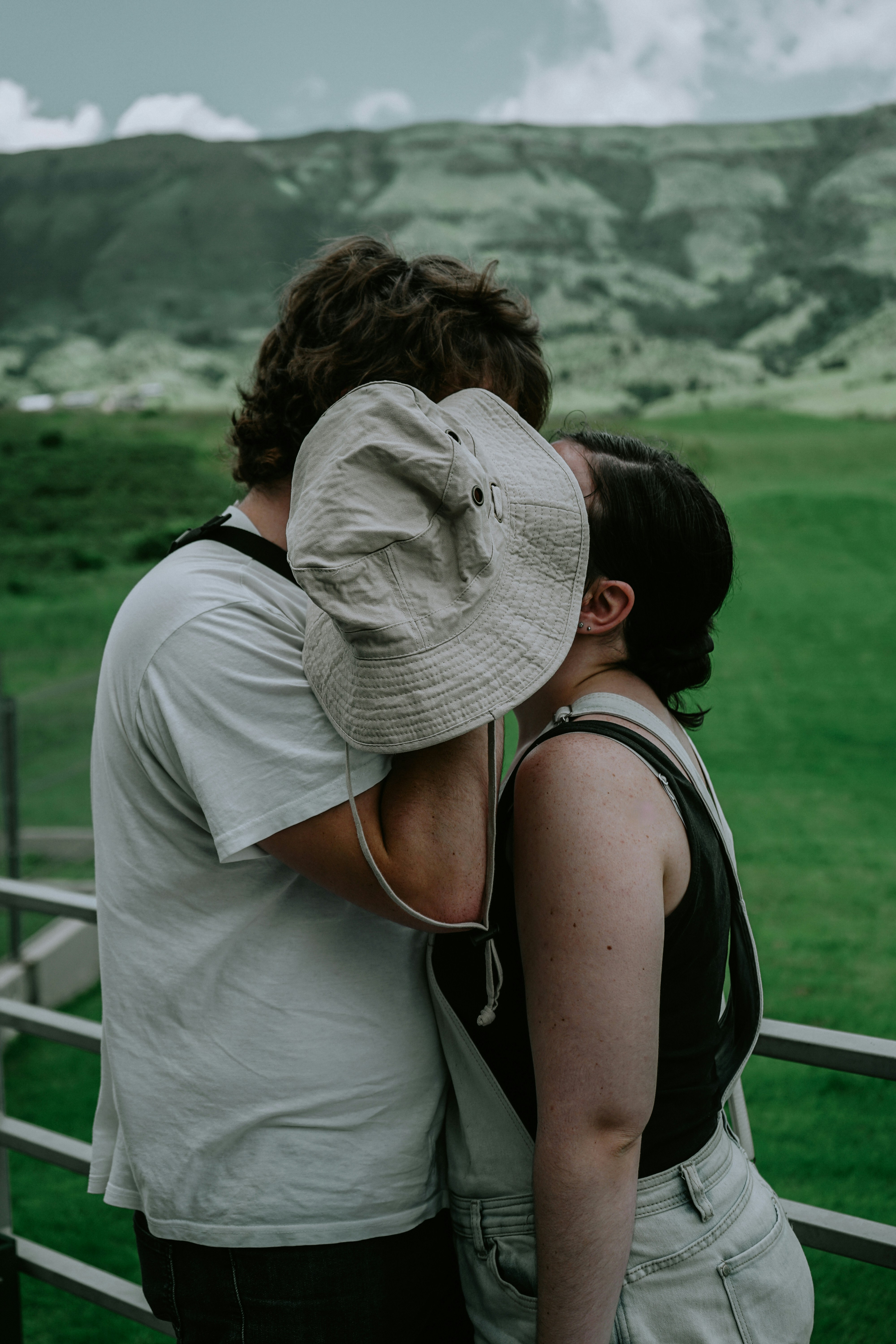 Kiss at the Overlook: Quiet Intimacy Amid Emerald Hills