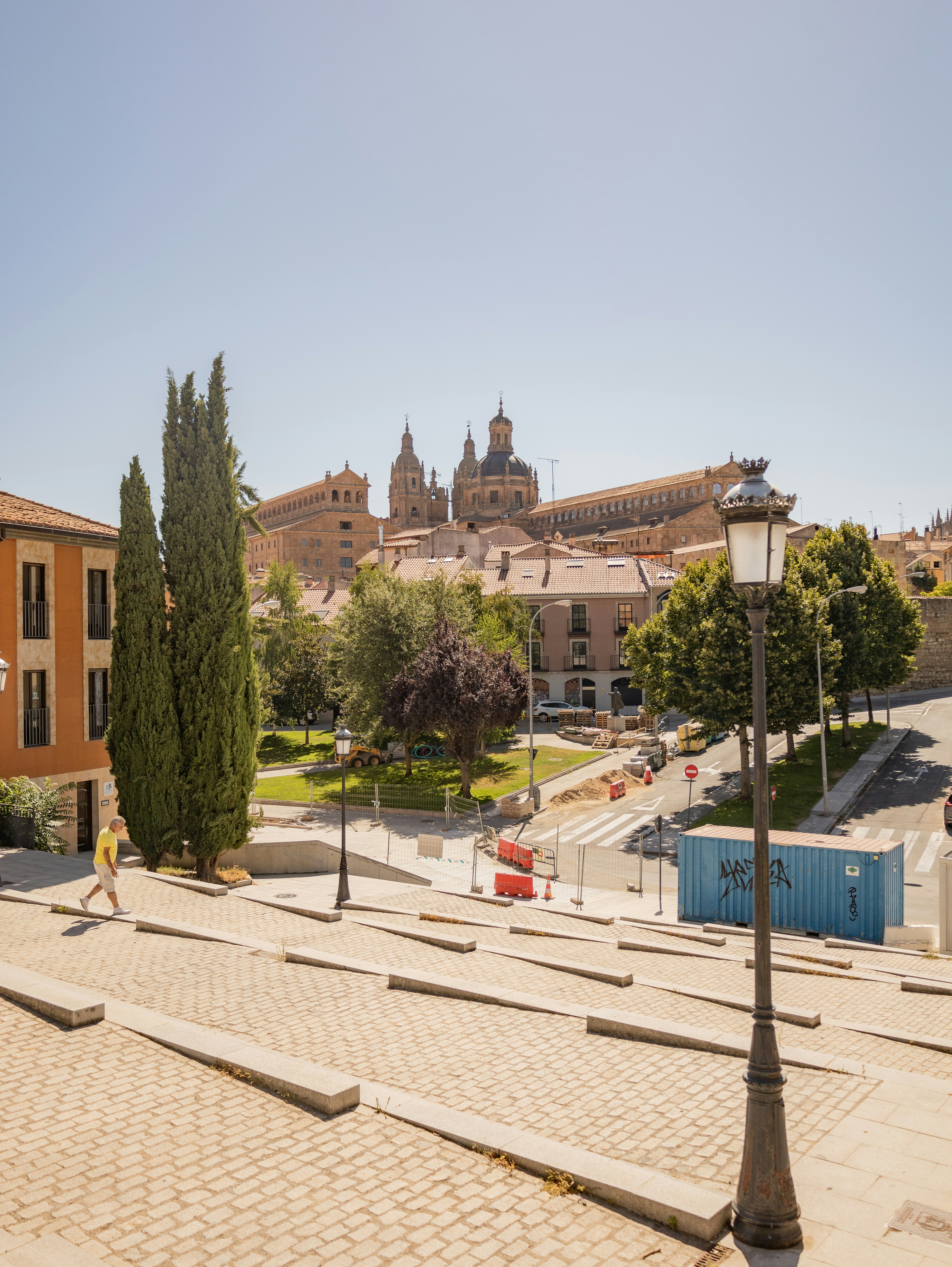 Cobbled Terrace Toward a Baroque Skyline