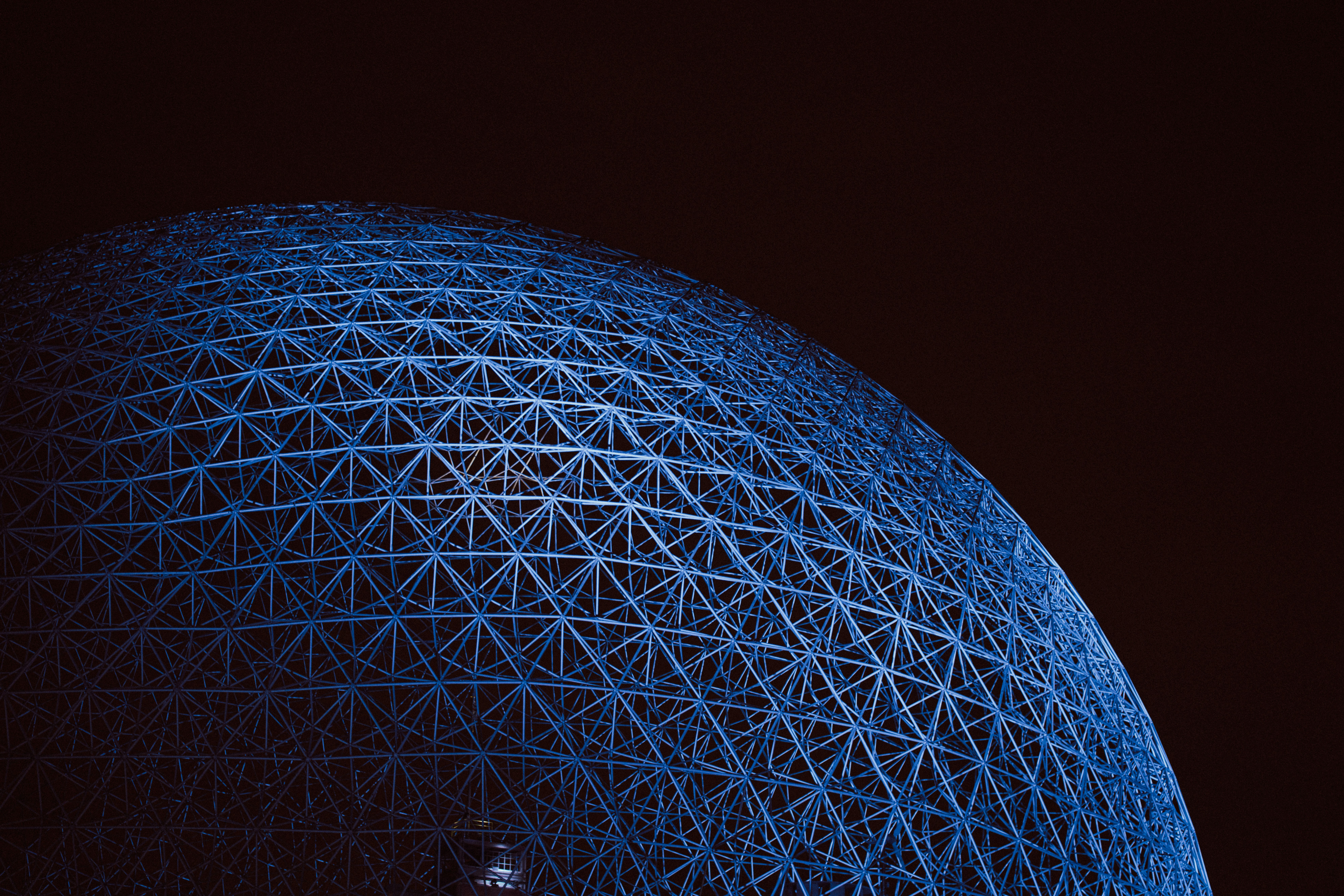 Blue Lattice Dome: Night Exposure Over the Geodesic Sphere