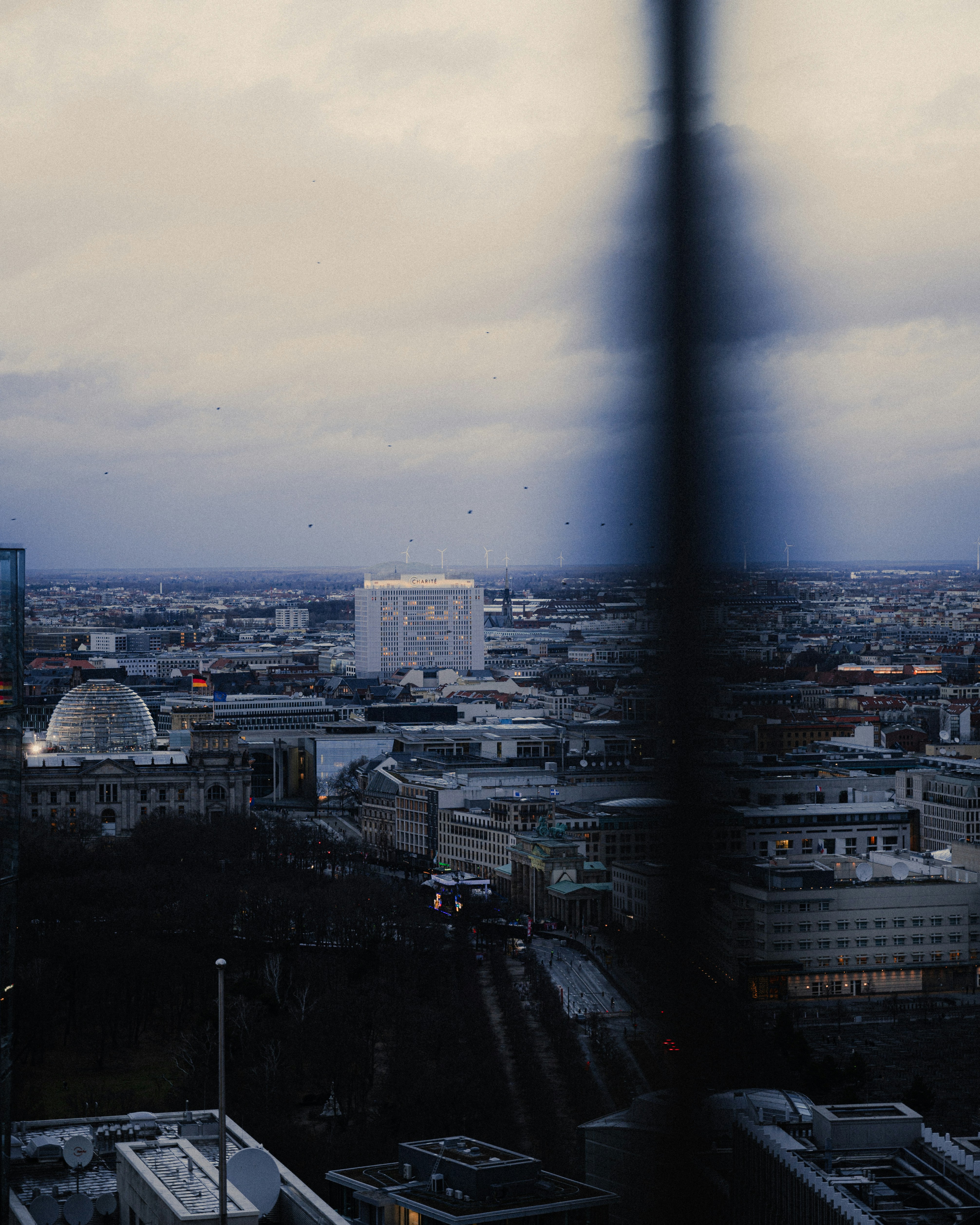 Horizon Framed by a Window Seam: A Glass-Domed Cityscape