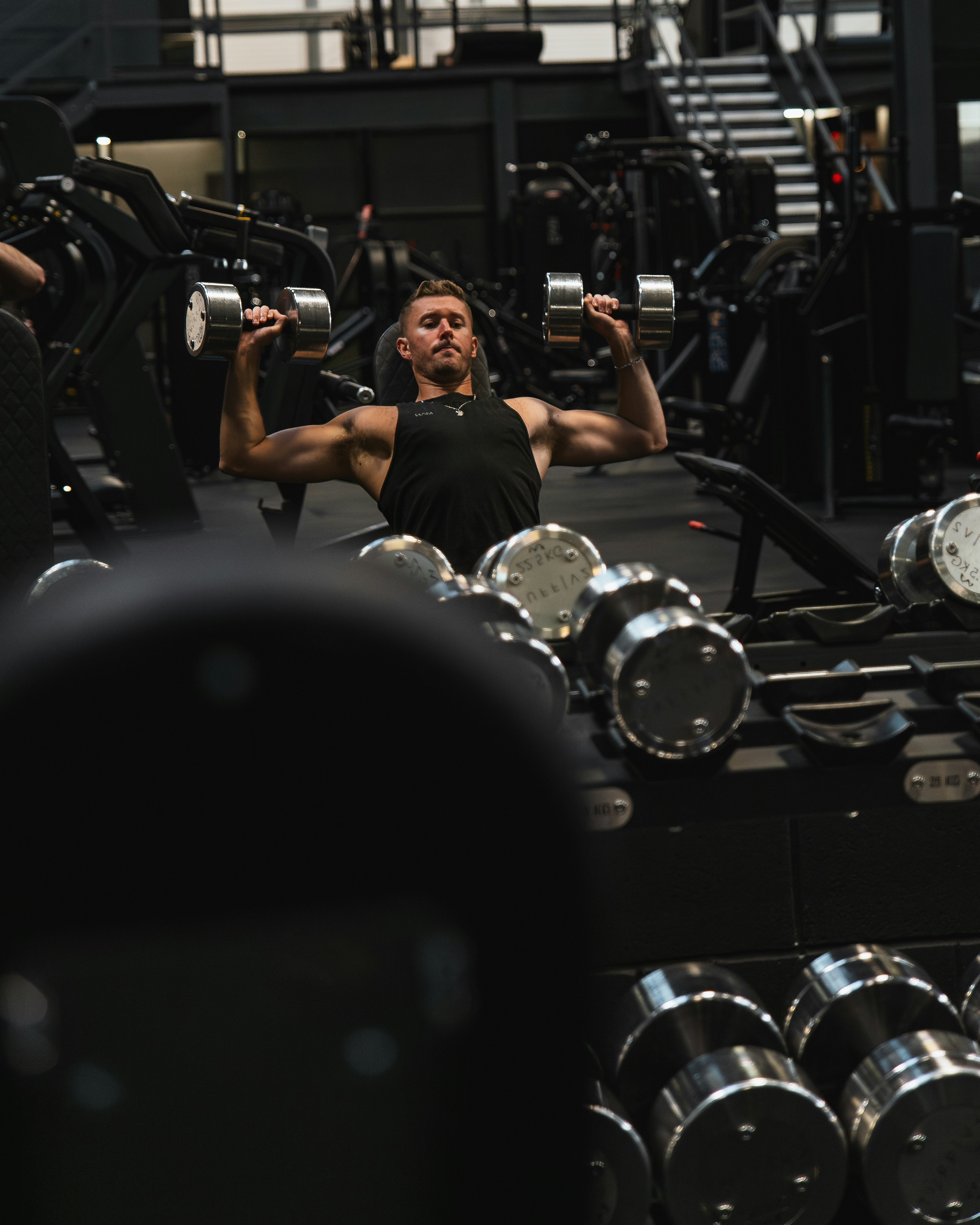 A man lifting a barbell in a gym photo – Free Fitness Image on Unsplash