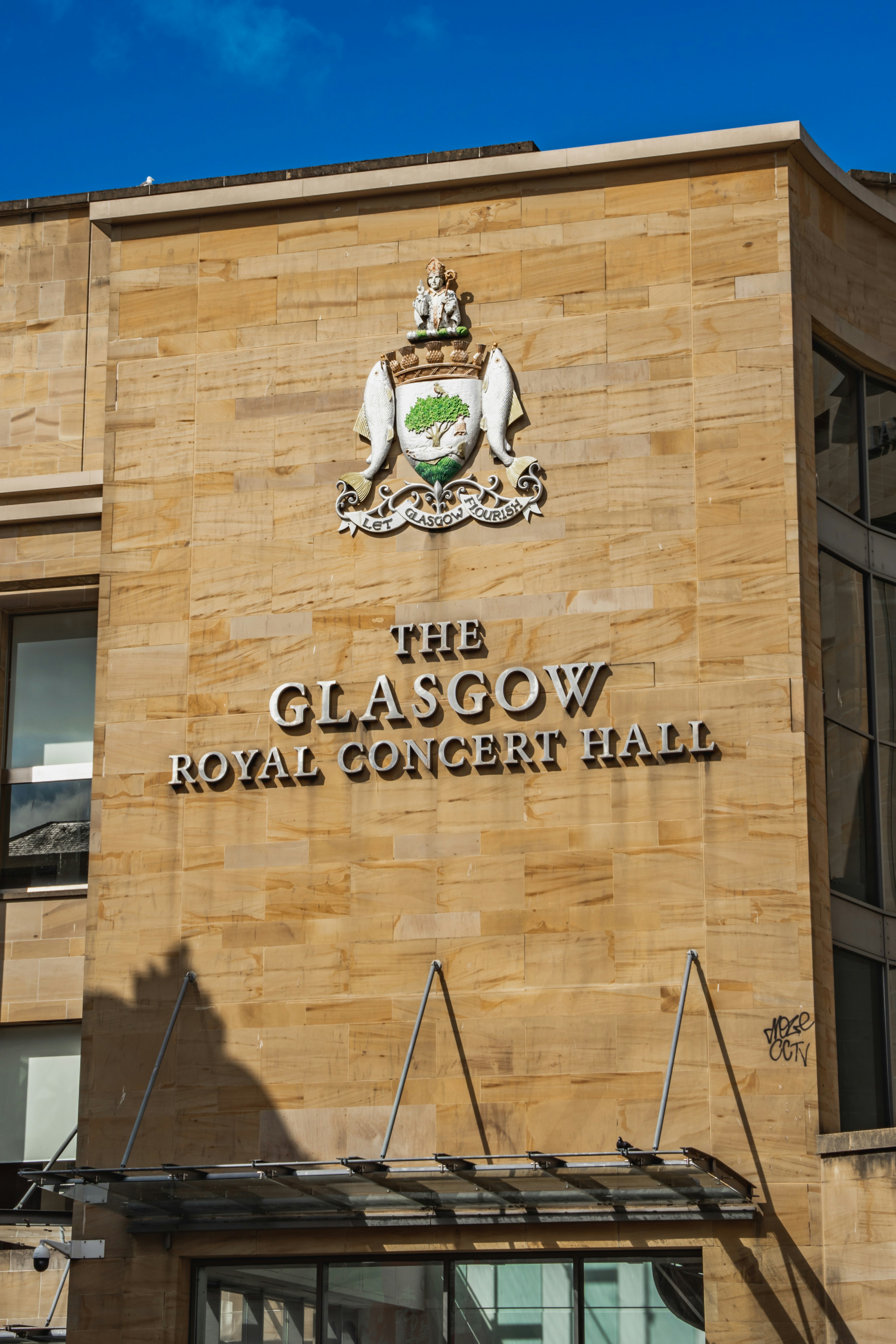 The glassow royal concert hall sign on the side of a building photo ...