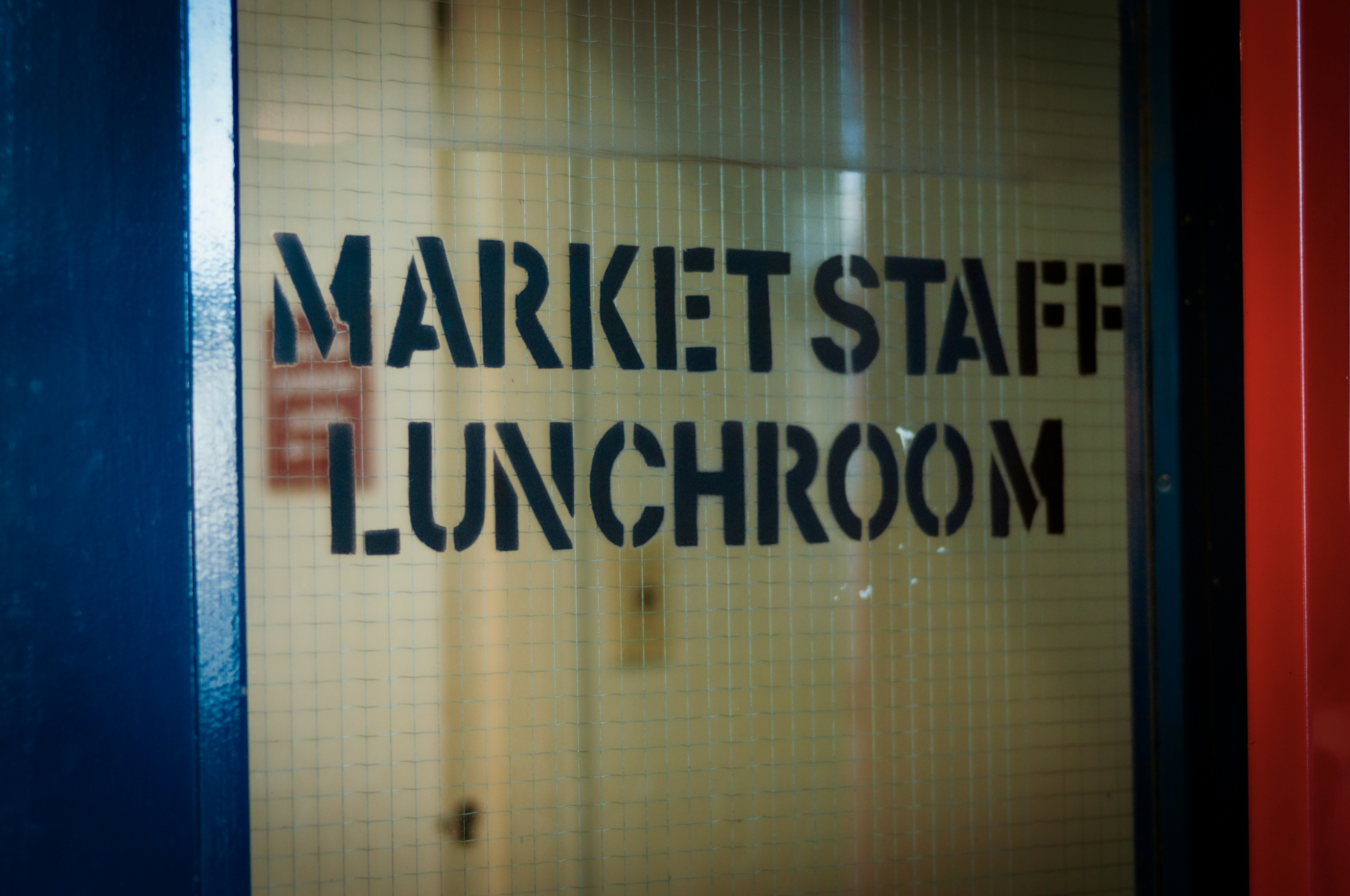 Stencil-Style Market Staff Lunchroom Sign Through Glass Panel