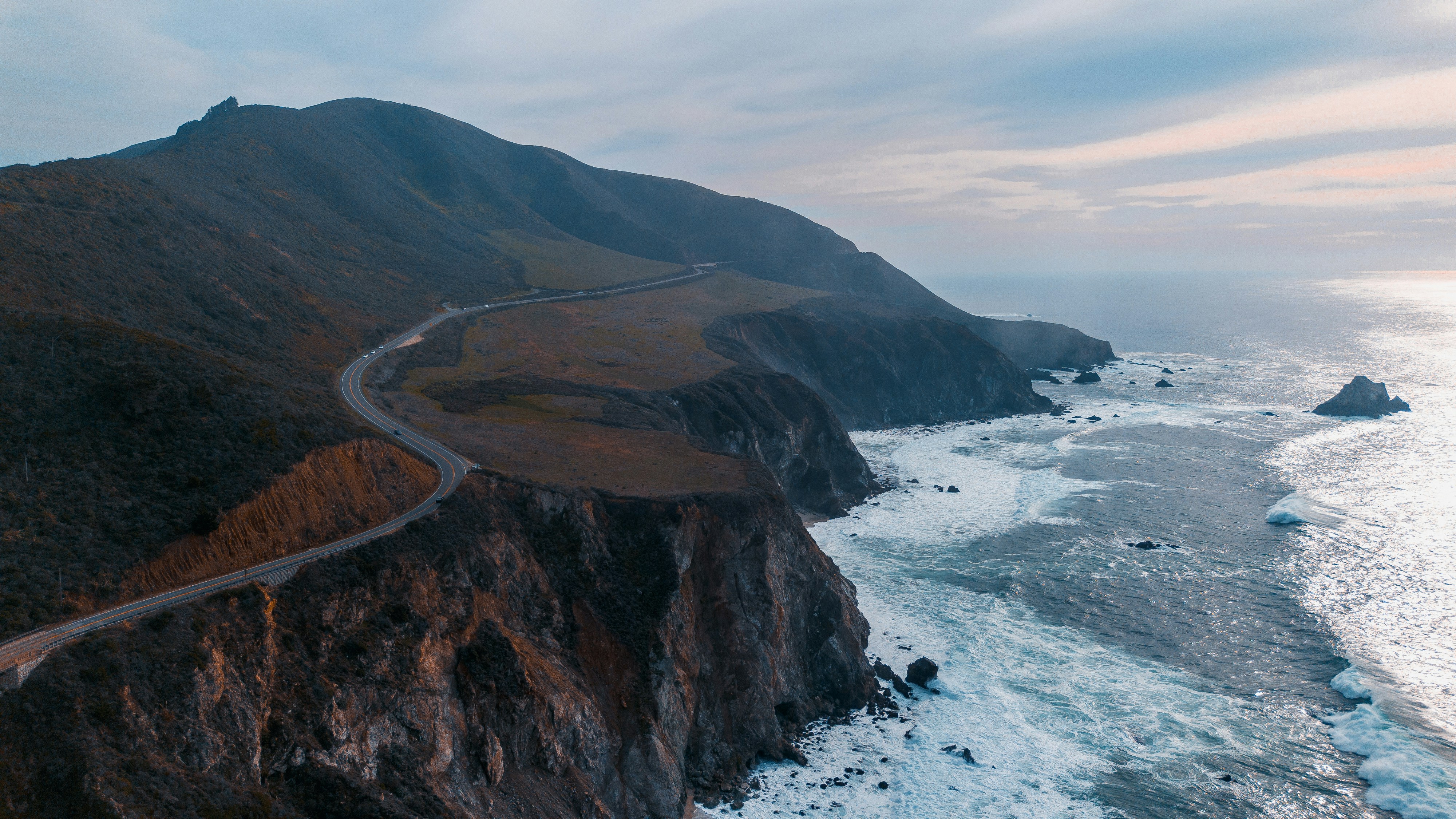 An aerial view of a road near the ocean photo – Free Grey Image on Unsplash