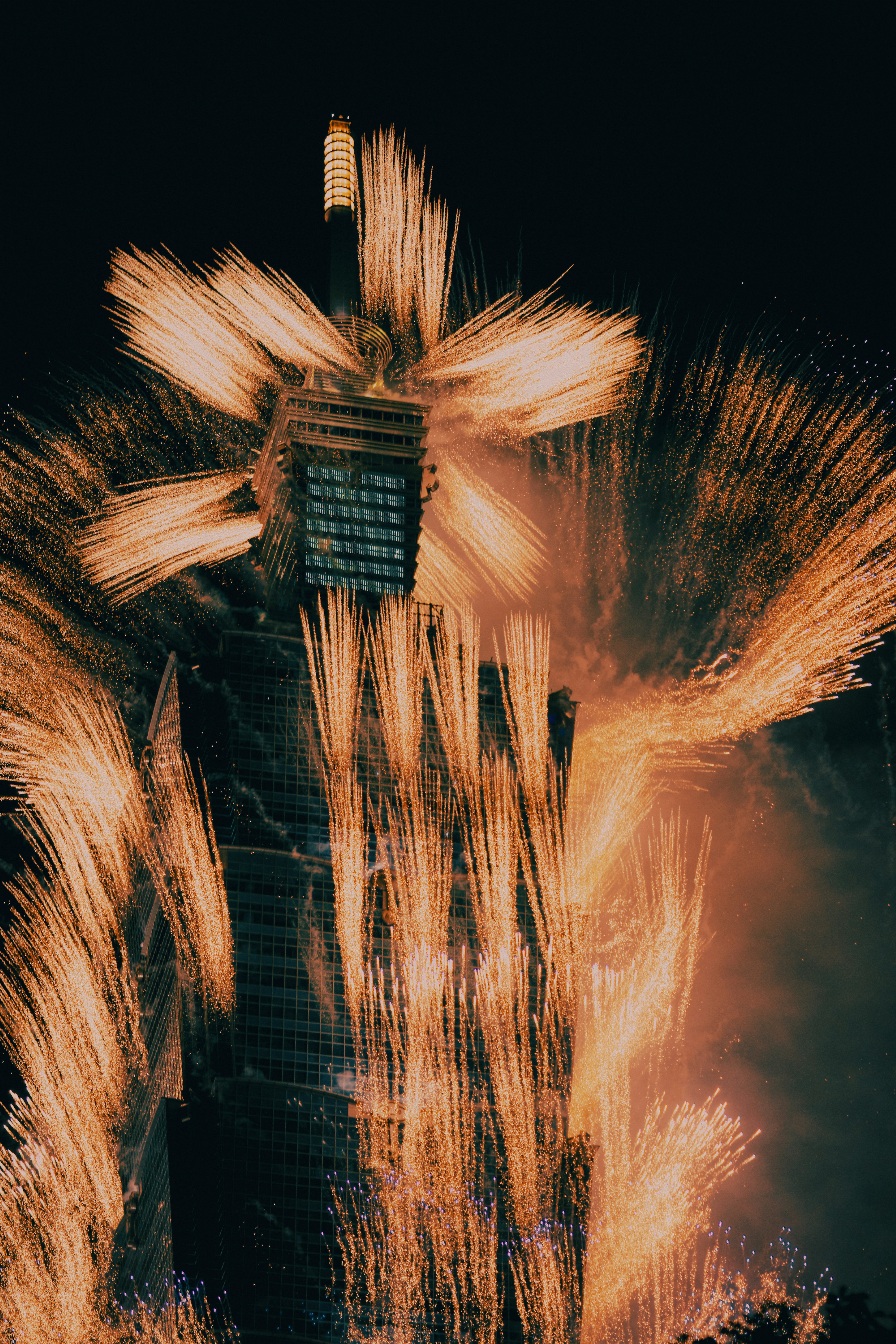 Fireworks are lit up in front of a tall building photo – Free Taiwan ...