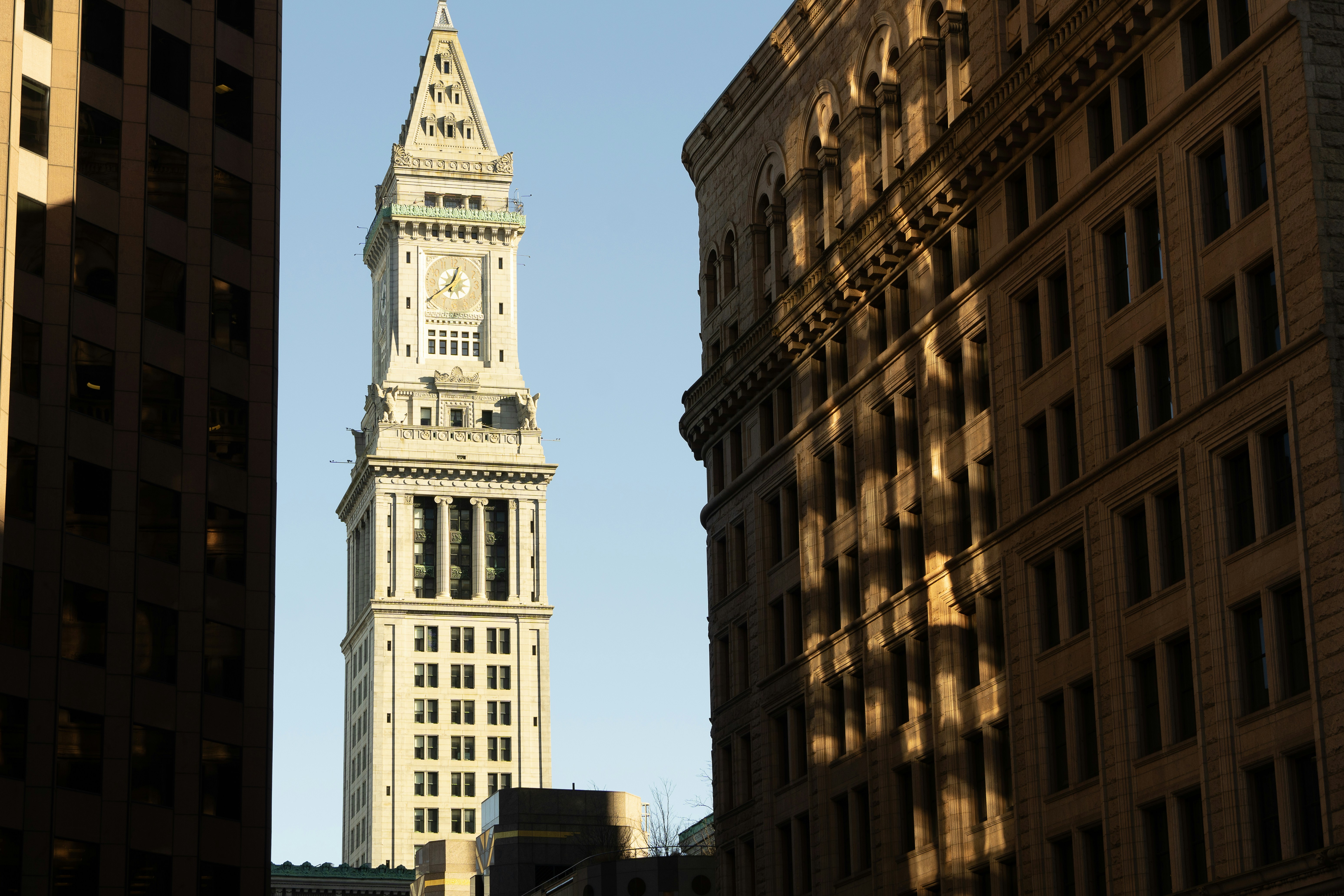 a tall clock tower towering over a city