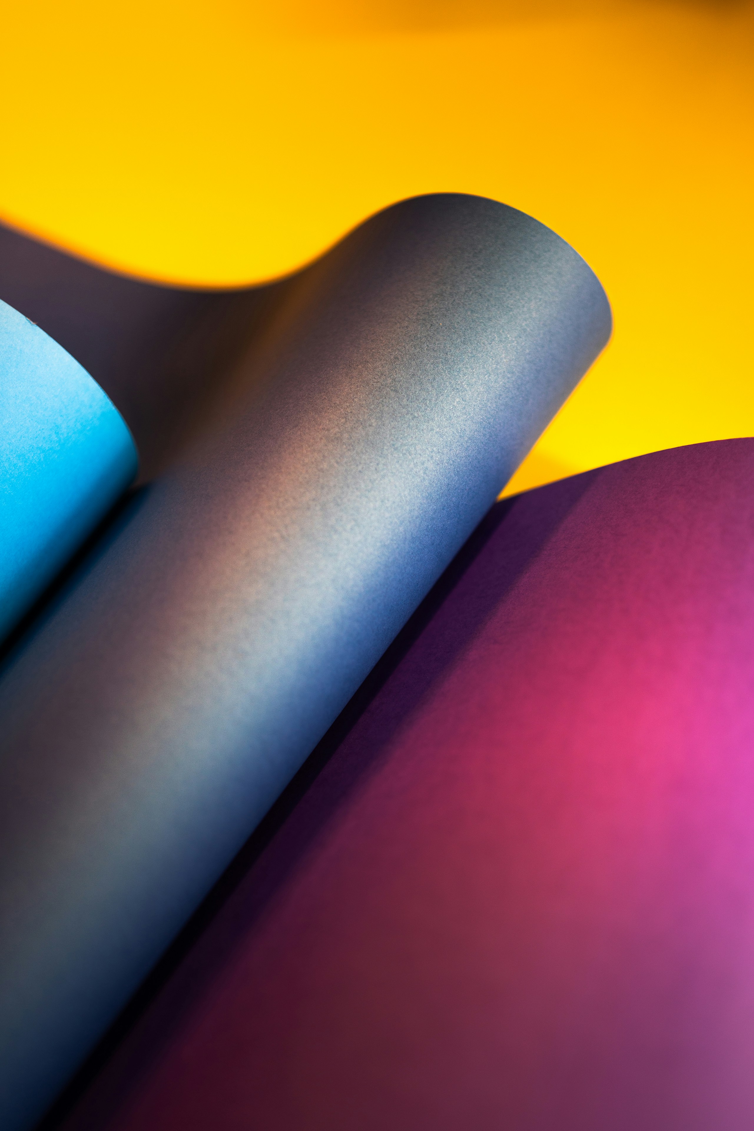 A close up of a roll of colored paper photo – Free Purple Image on Unsplash