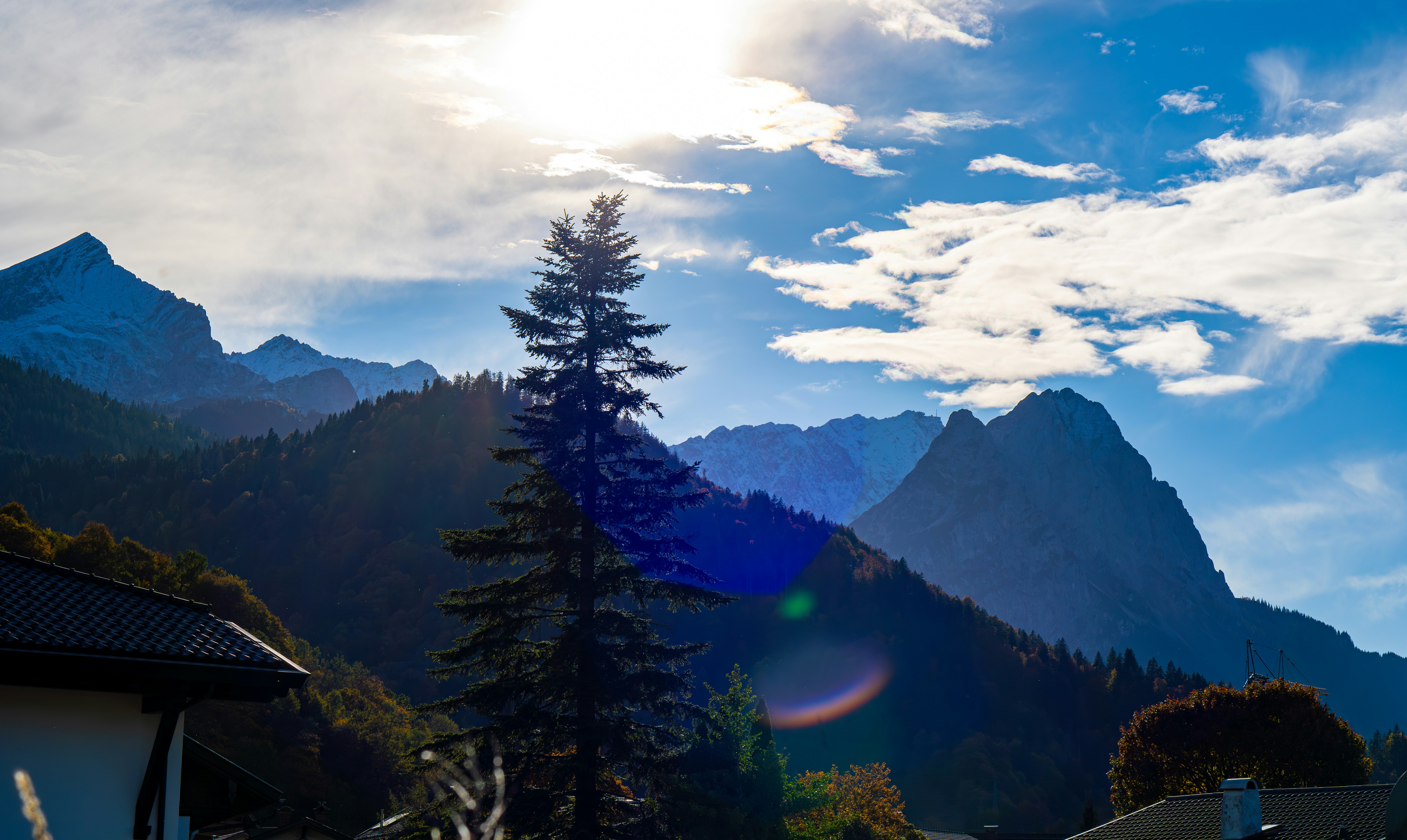 Sunlit Peaks Over a Quiet Alpine Village