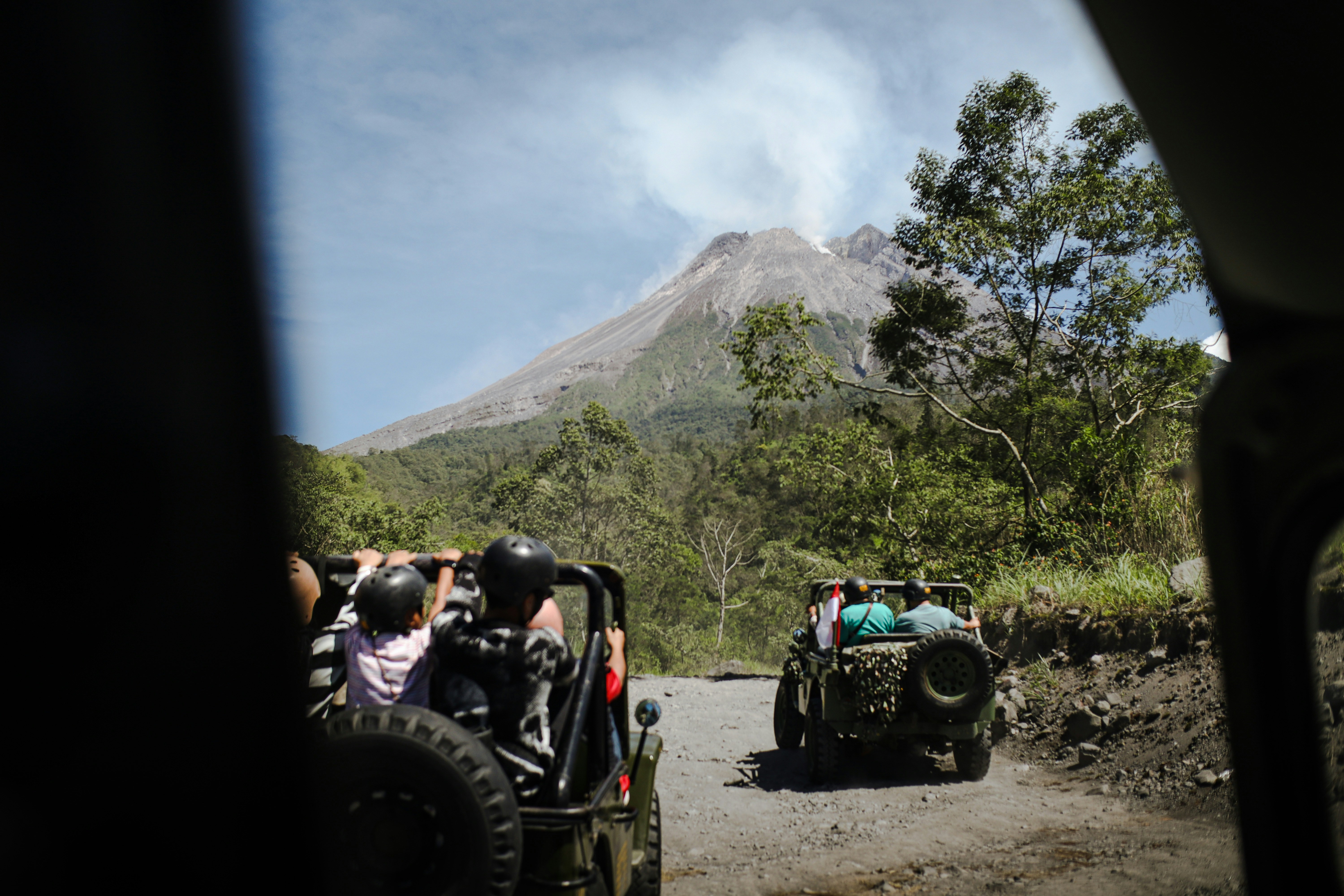 A group of people riding on the back of four wheelers photo – Free ...