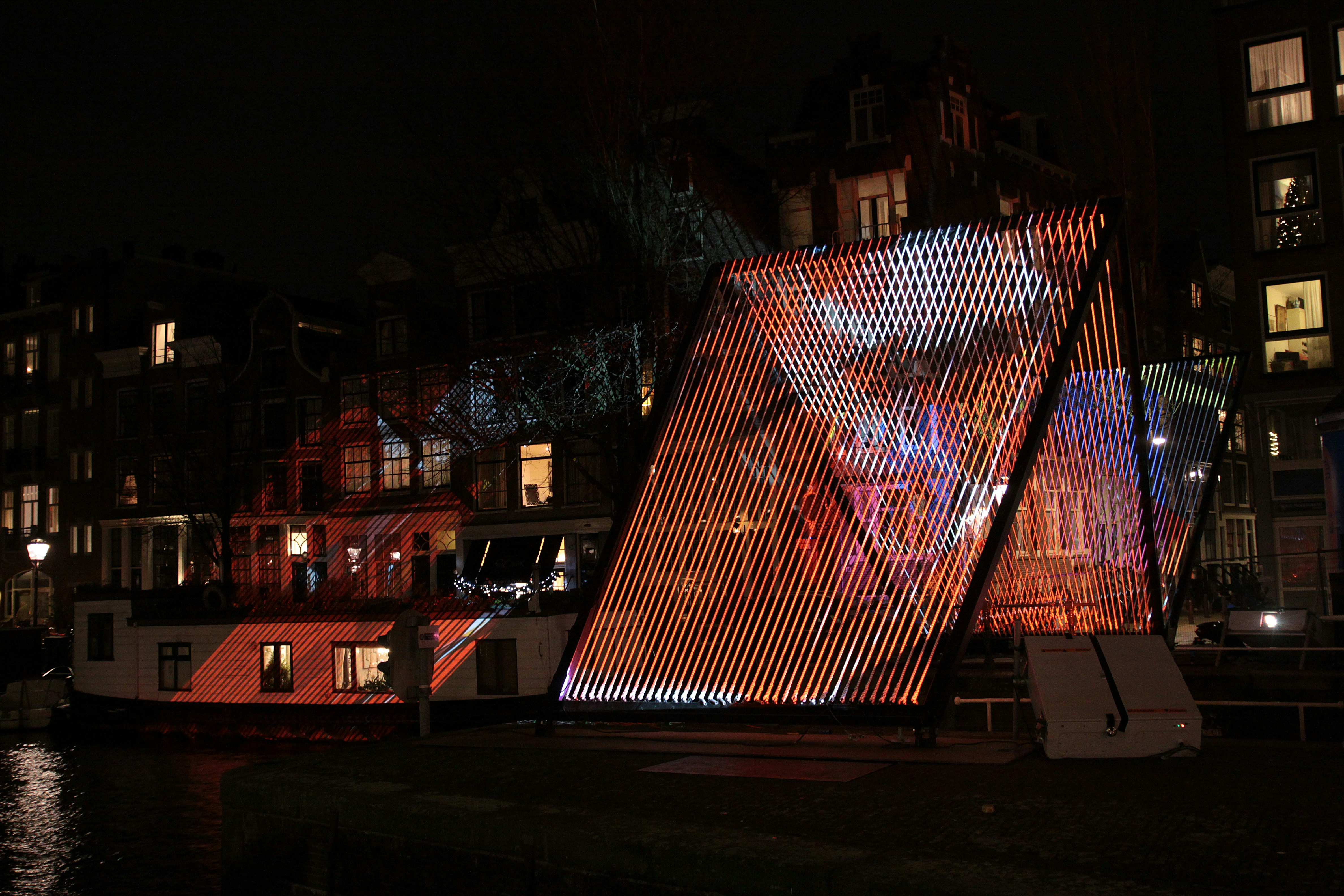 Illuminated Tilt-Frame Installations Reflecting on Night Canal