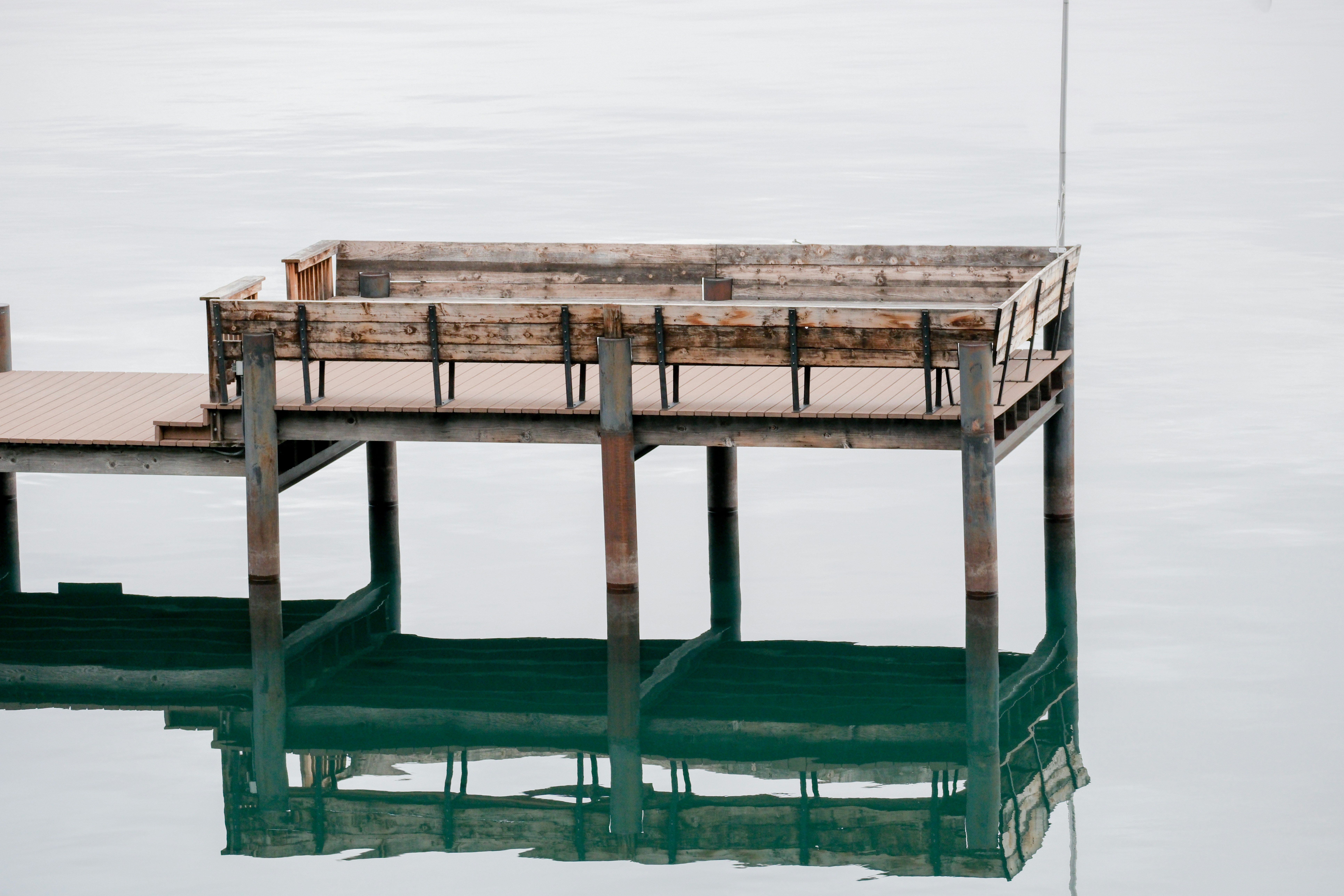 a wooden dock sitting on top of a body of water