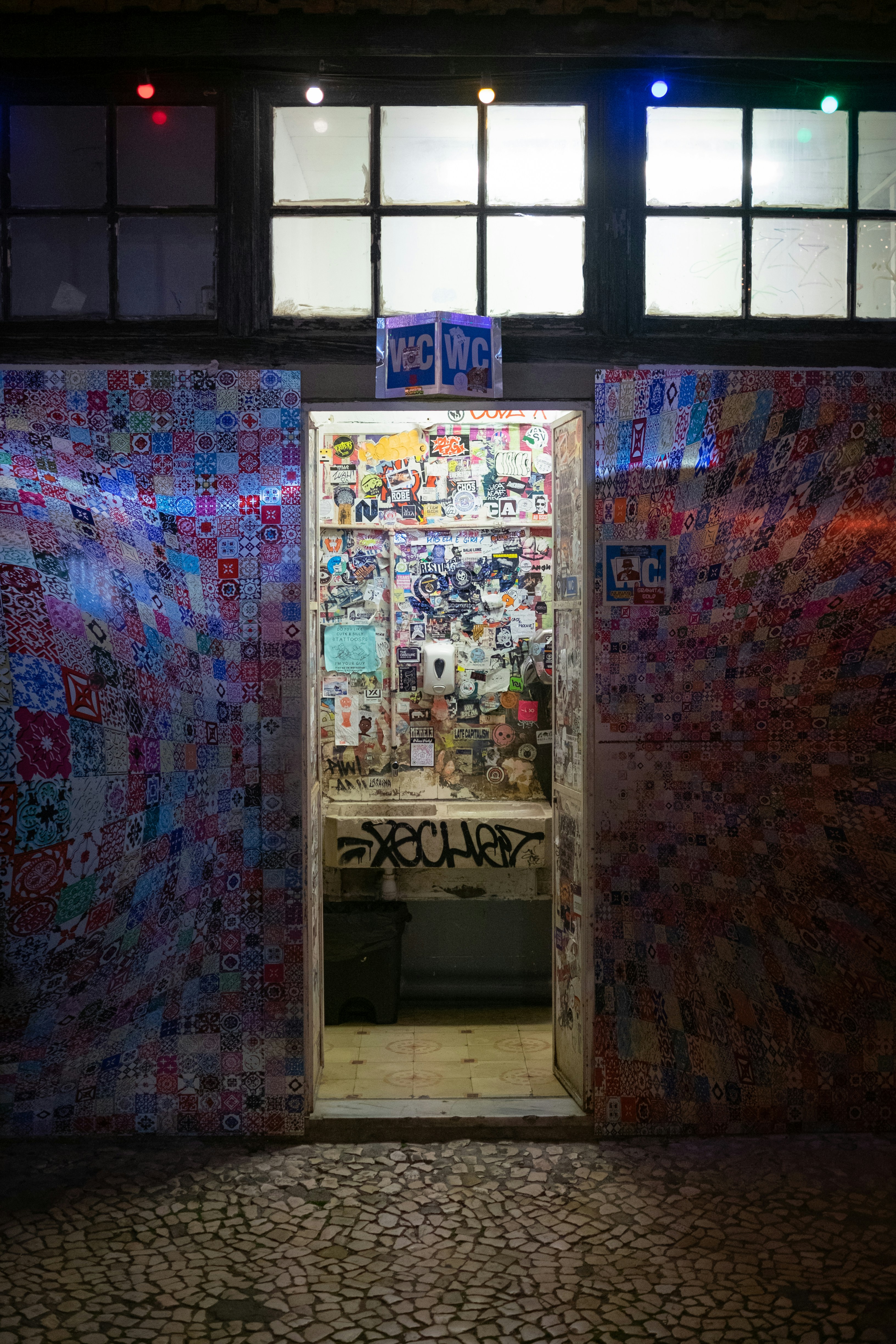 A room with a lot of stickers all over it photo – Free Art Image on ...