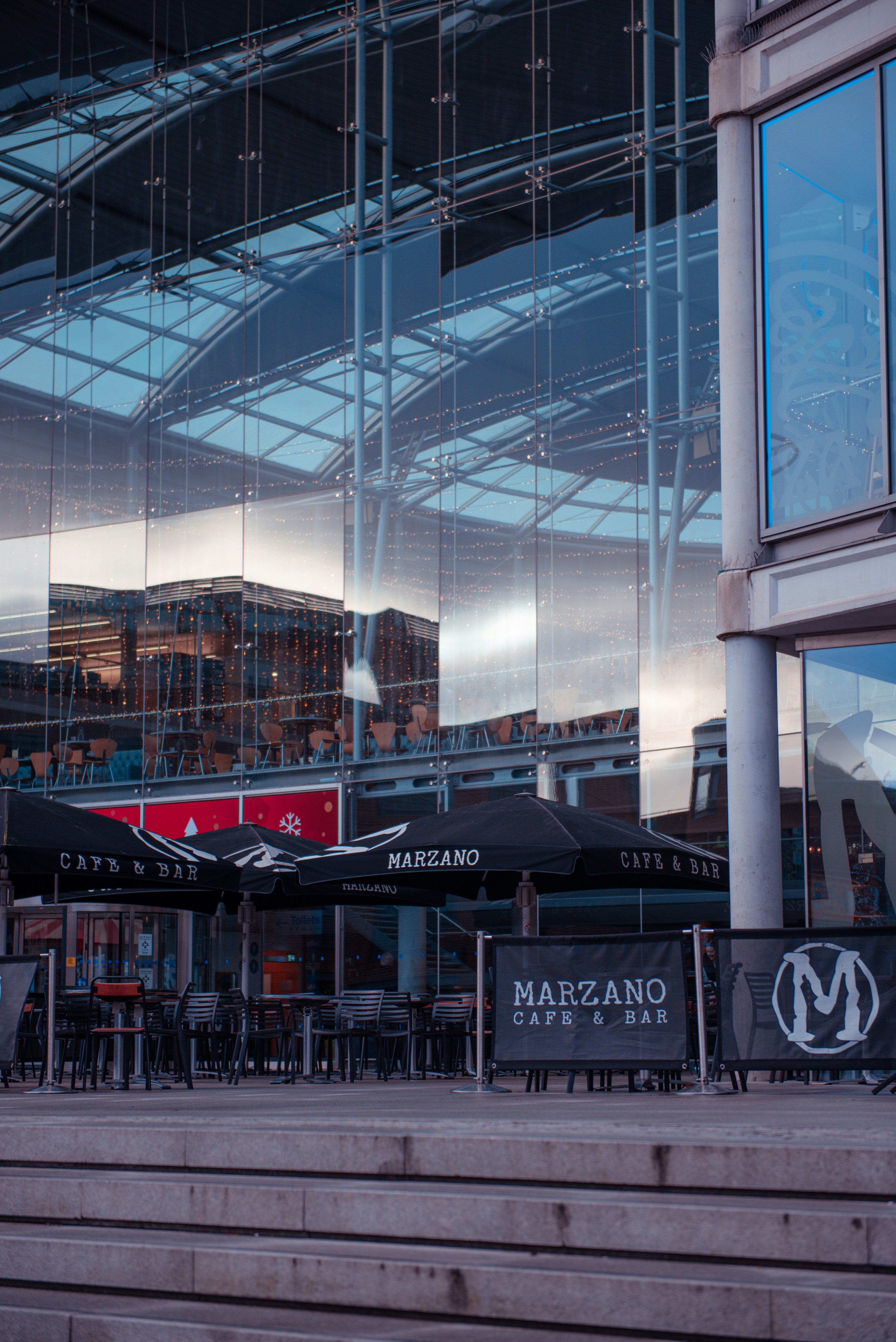 Marzano Café & Bar under a Glass Curtain: Reflections on a Modern City Atrium
