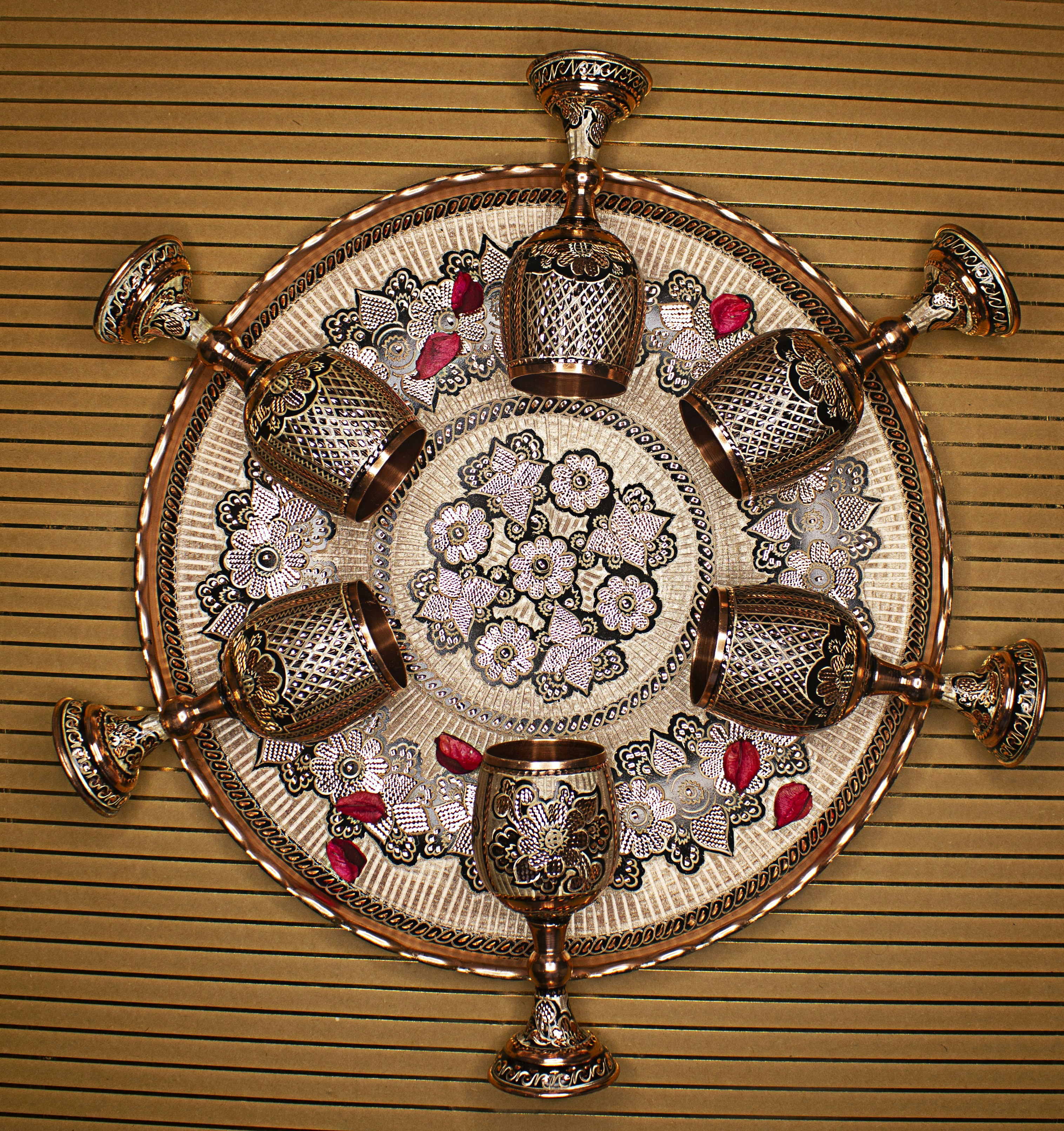 Brass Bloom: A Top-Down Portrait of an Ornate Chandelier Medallion