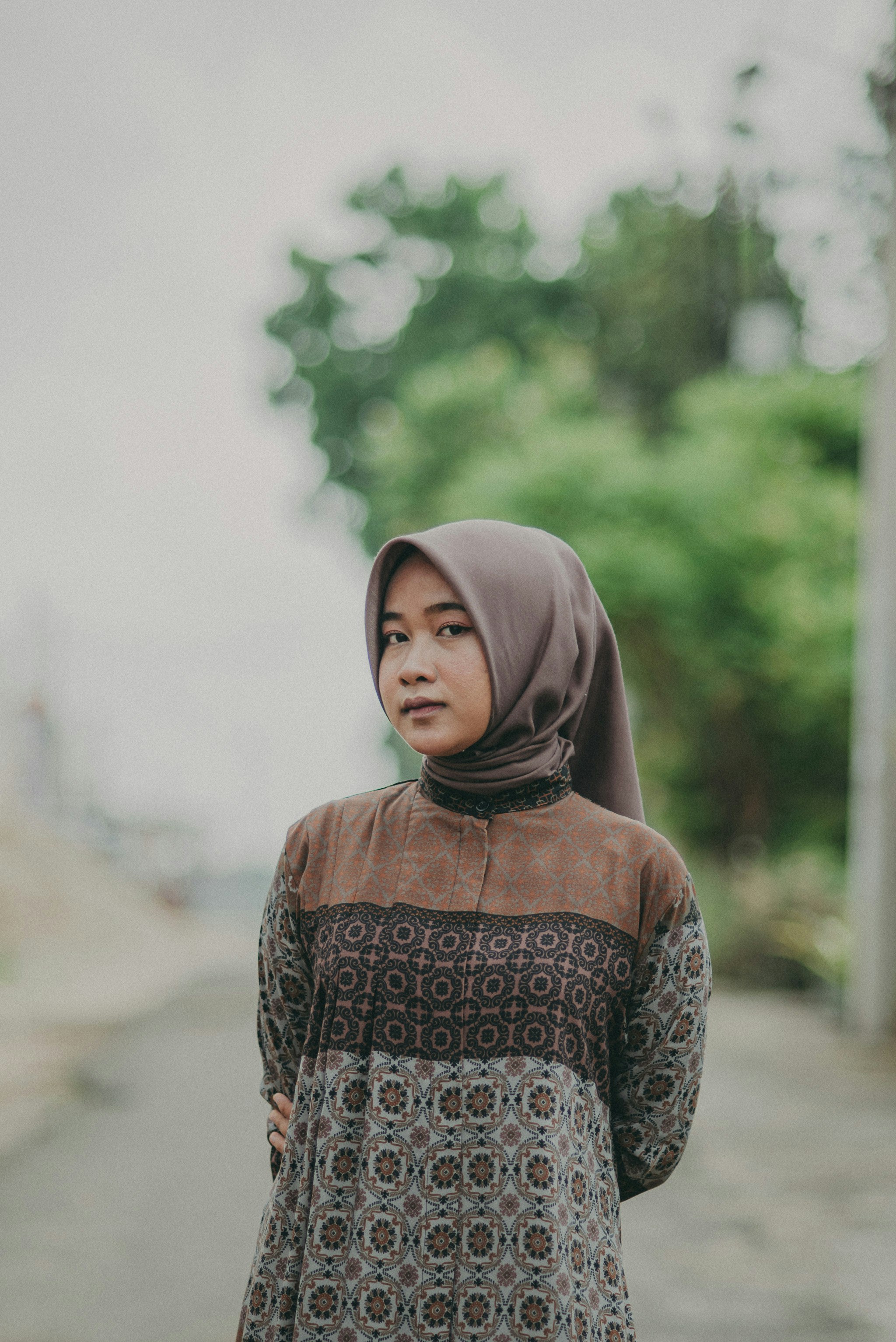 Muted Street Portrait: Gaze Beneath a Hijab