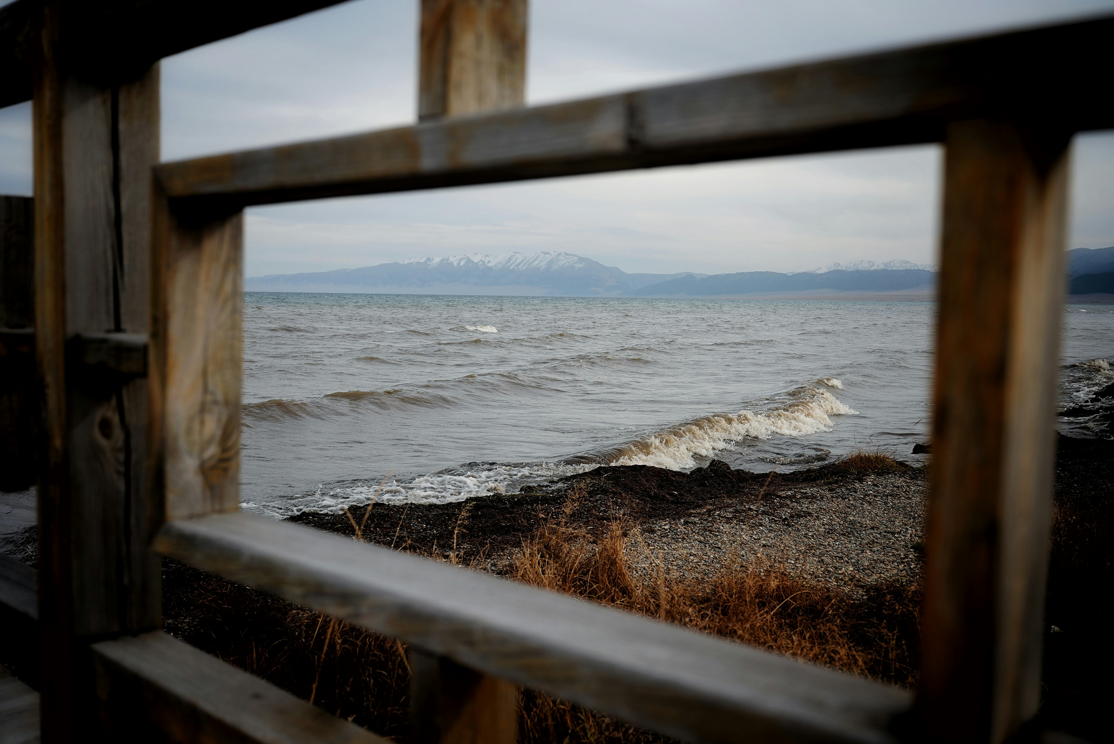 A view of a body of water through a window photo – Free Beach Image on ...