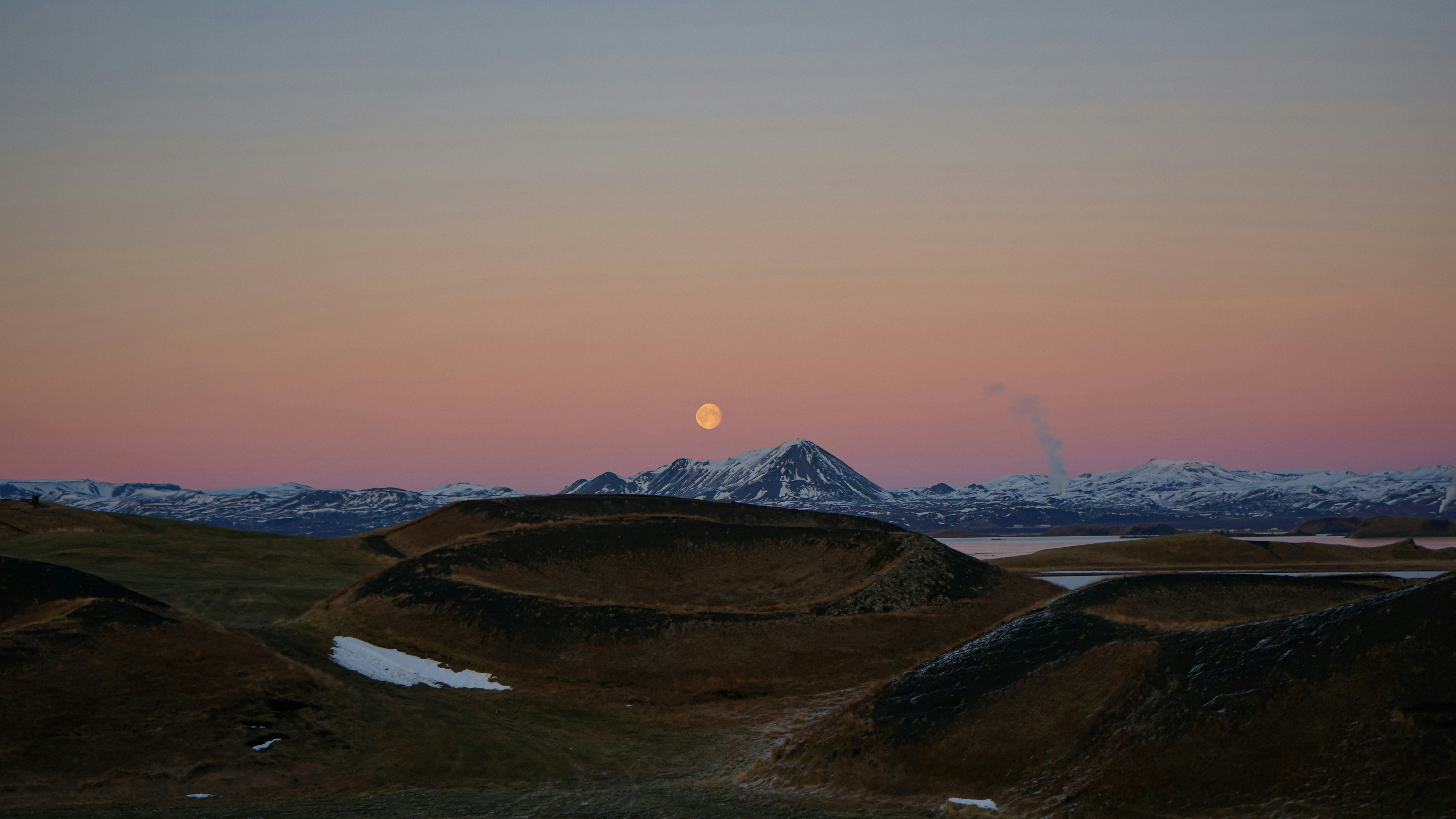 The moon is setting over a mountain range photo – Free Iceland Image on ...