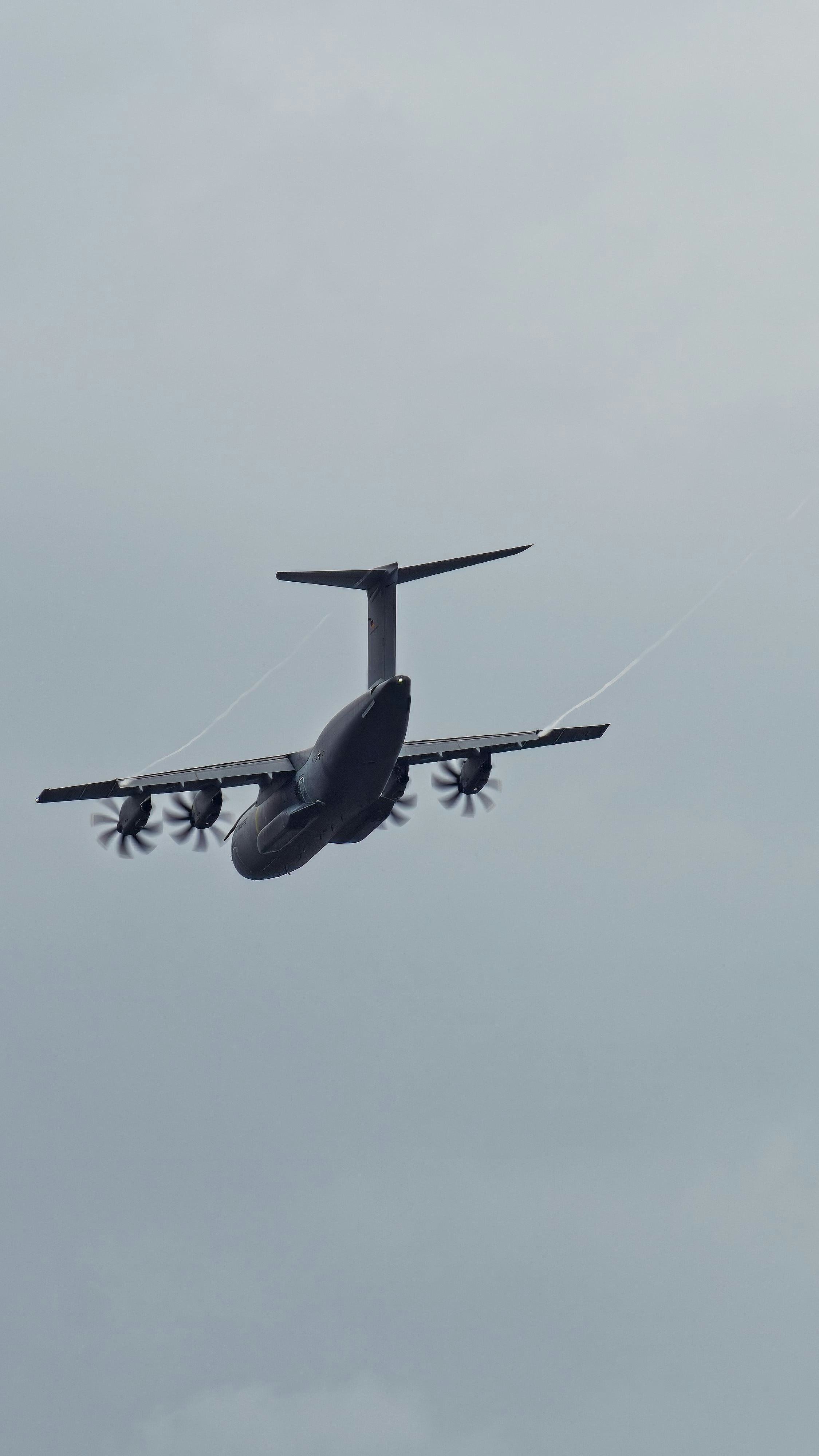C-130 in a Pale Sky: T-Tail Turboprop Ballet