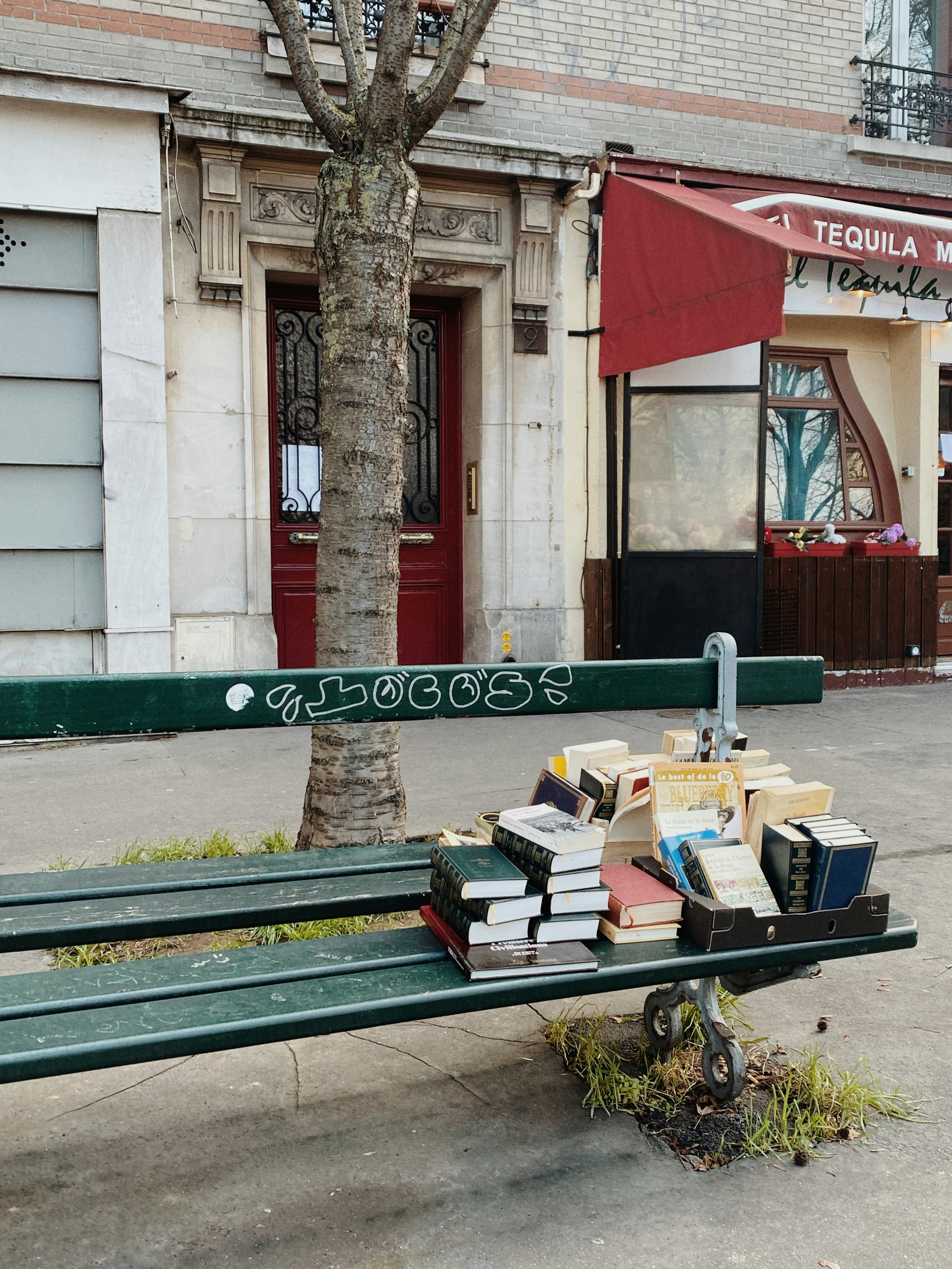 A bench with a bunch of books on top of it photo – Free Books Image on ...
