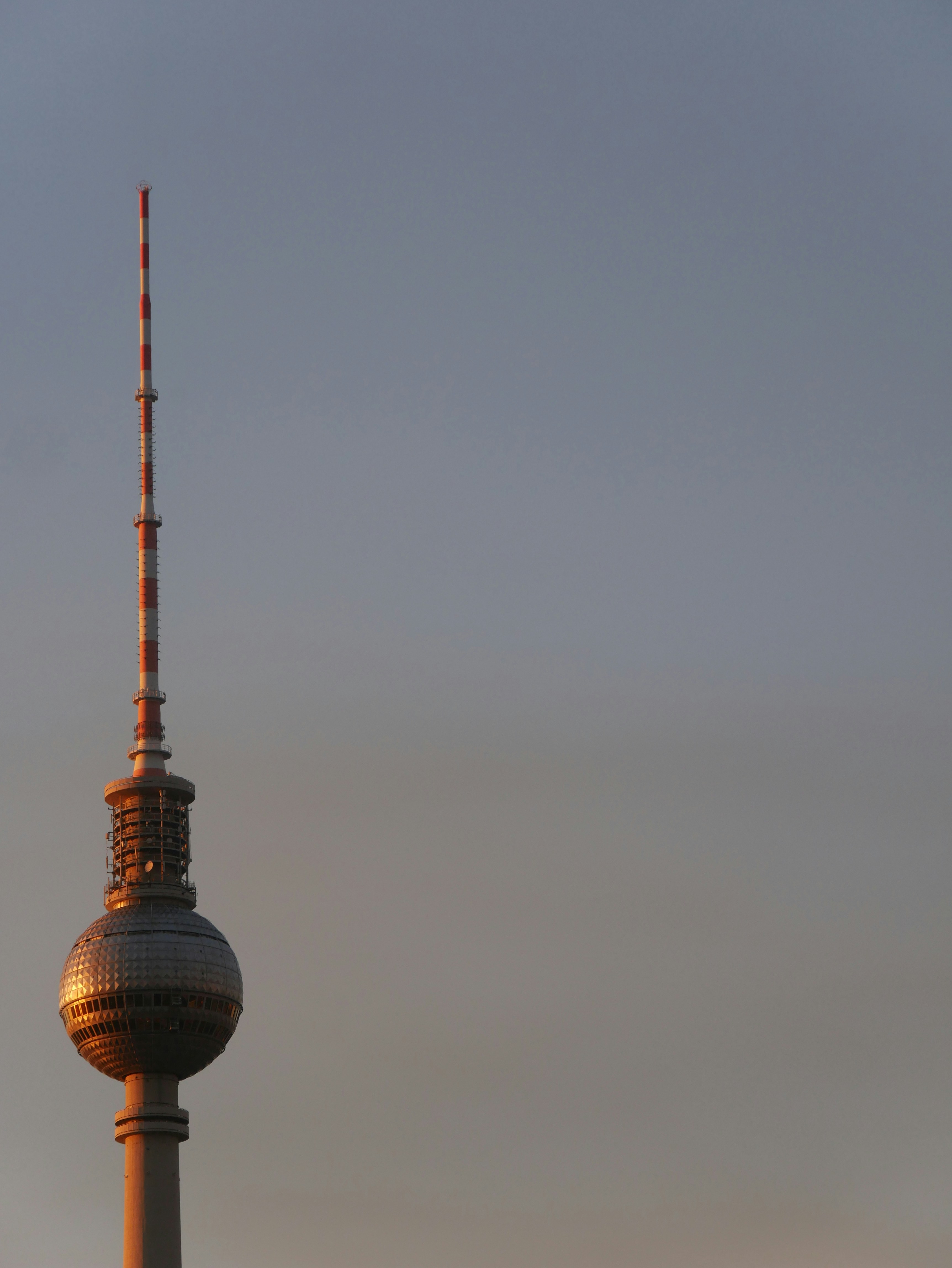 Golden Hour at the Berlin Spire: Sphere of Light Against a Pale Sky