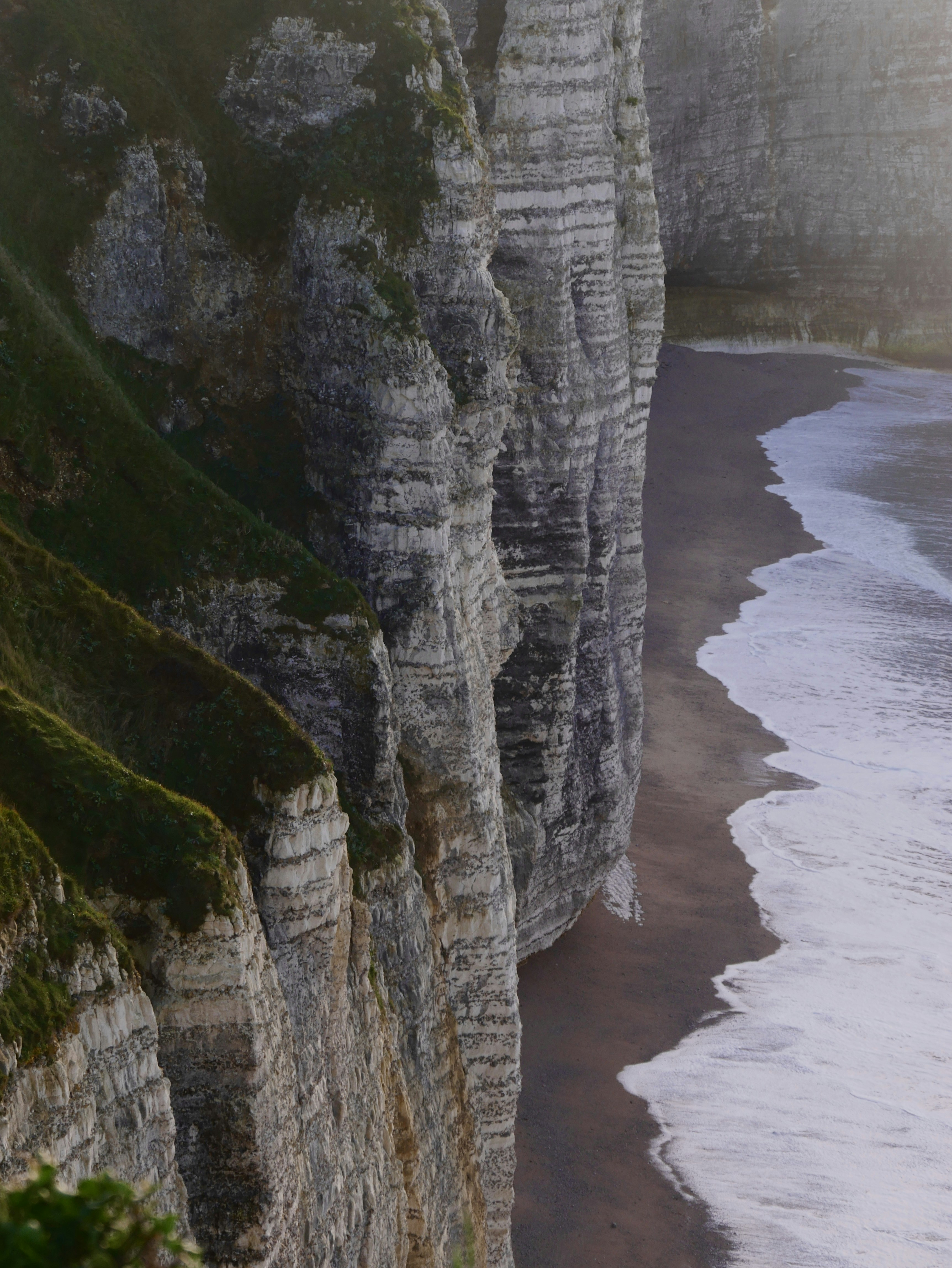 A view of a beach and cliffs from a high cliff photo – Free France ...