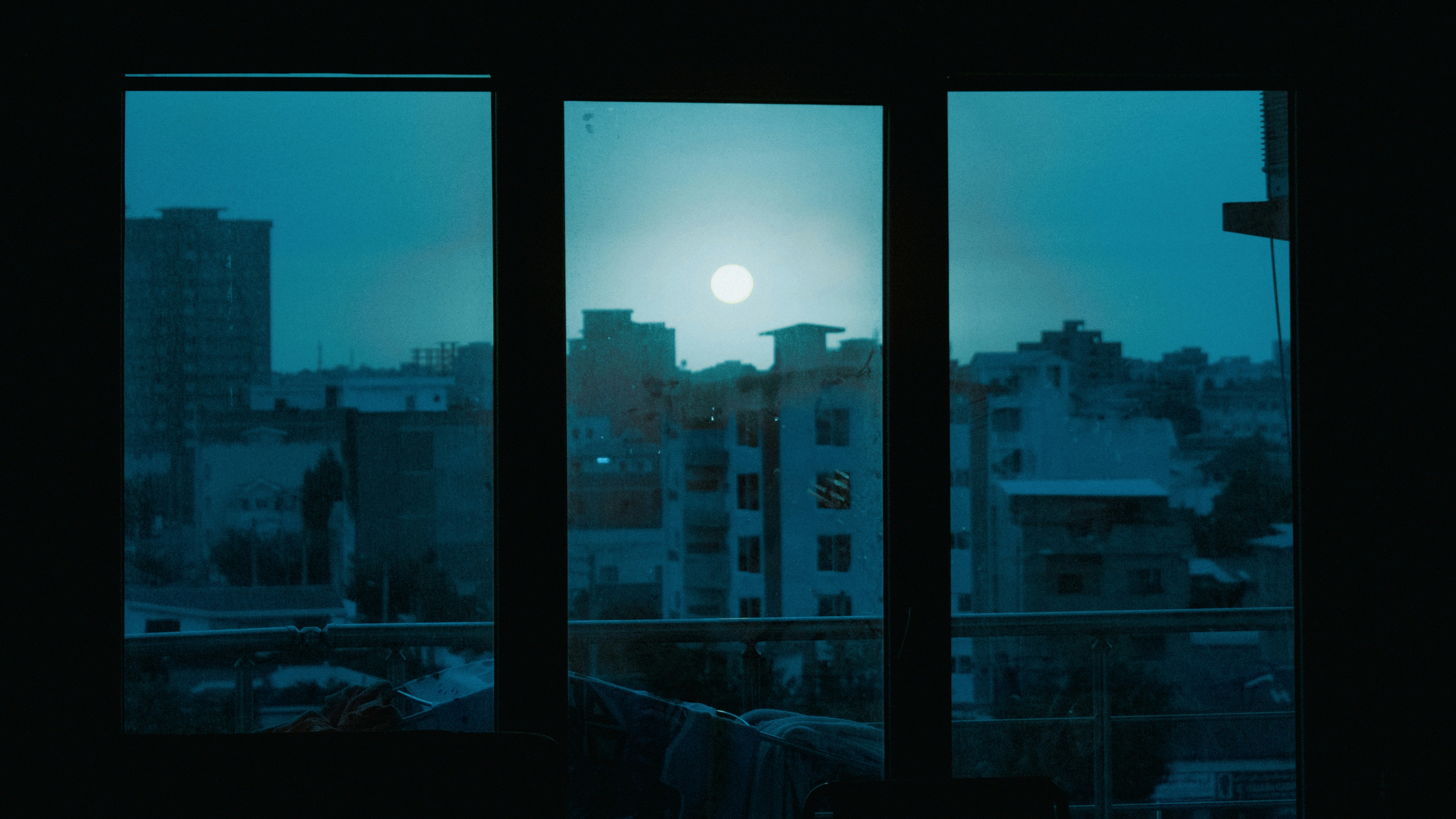 A view of a full moon through a window photo – Free Iran Image on Unsplash