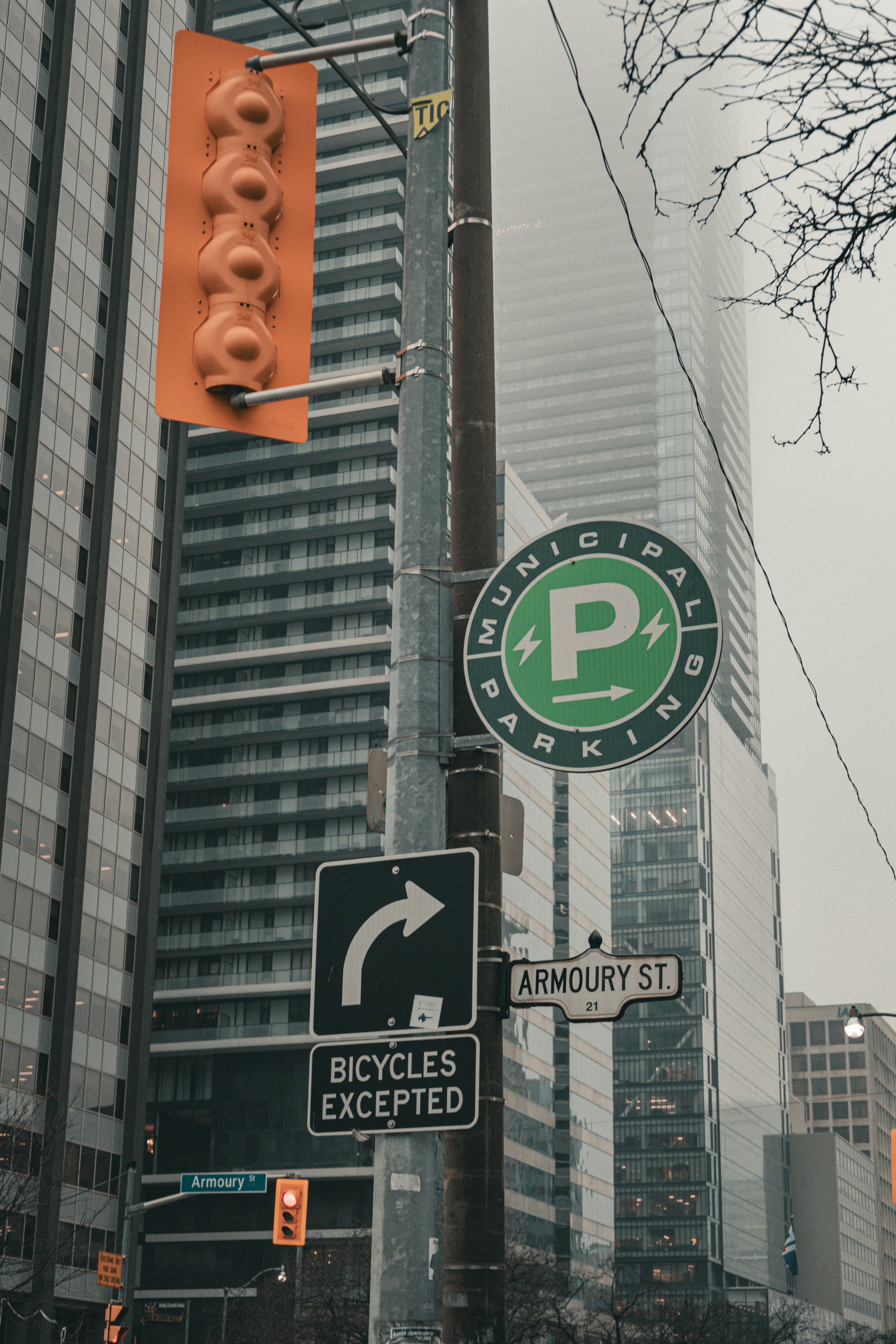 A traffic light and street signs in a city photo – Free Toronto Image ...