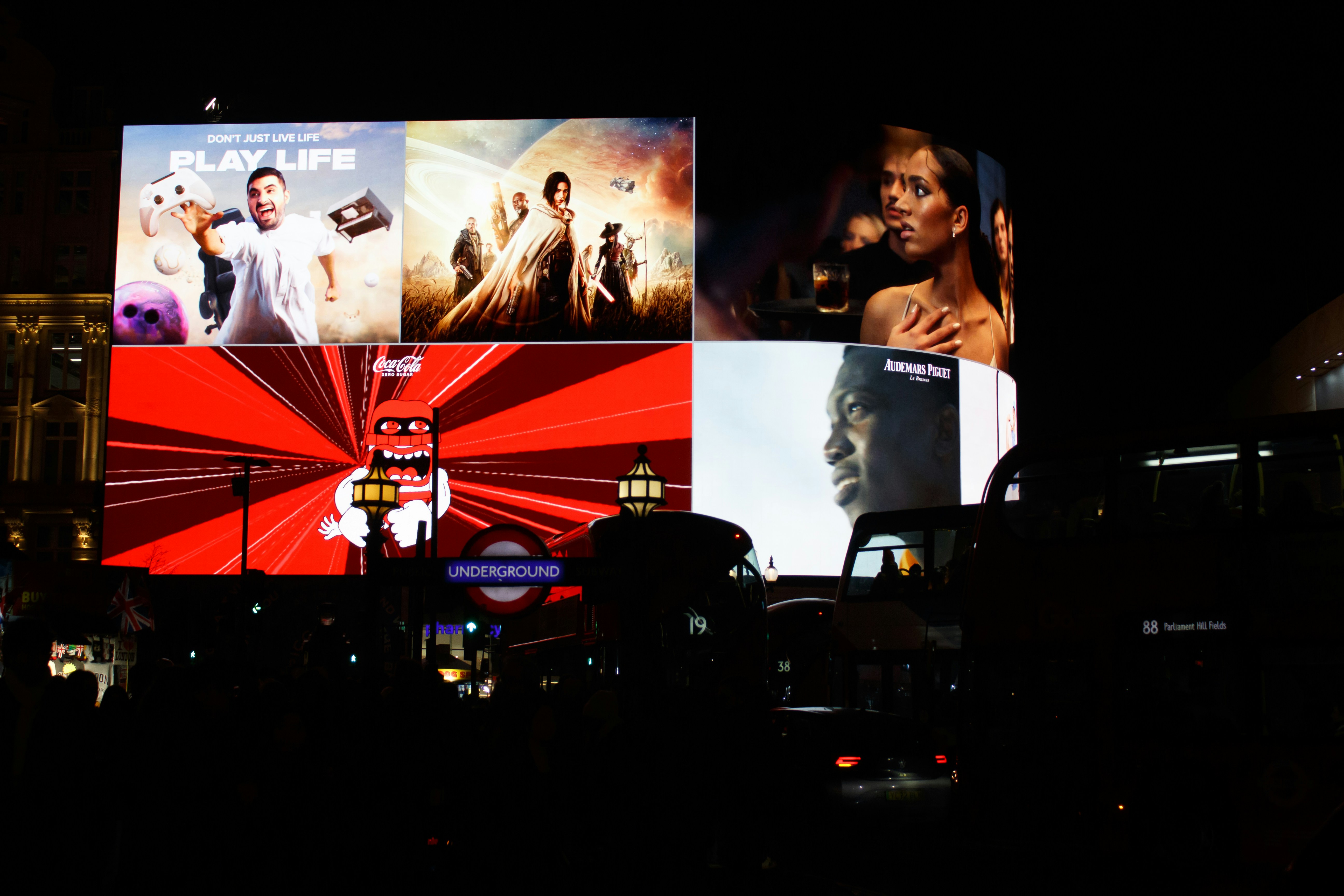 Nighttime Billboard Mosaic: Neon Panels Illuminating a City Square