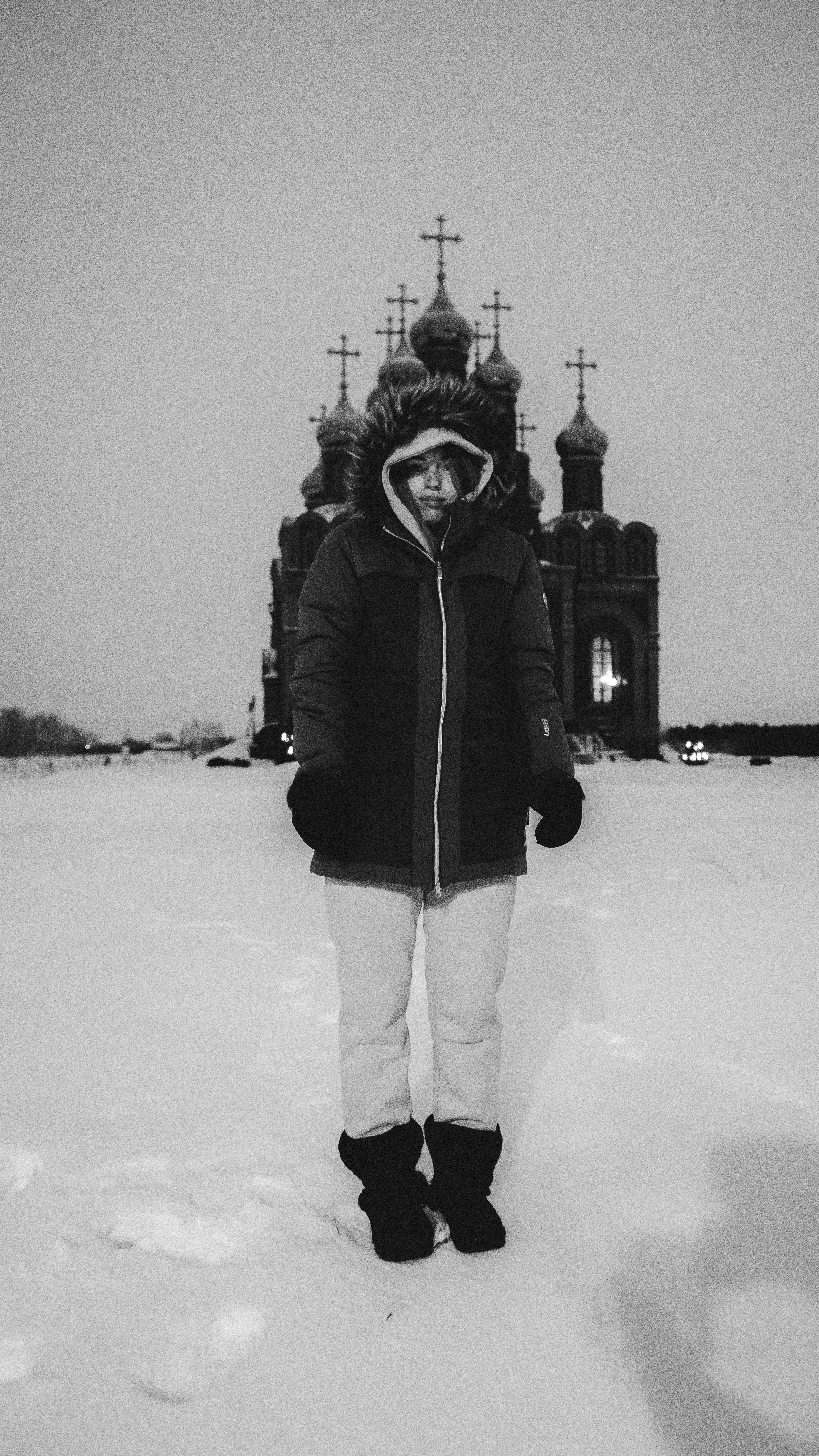 Hooded Quiet Before the Onion-Domed Cathedral in Snow