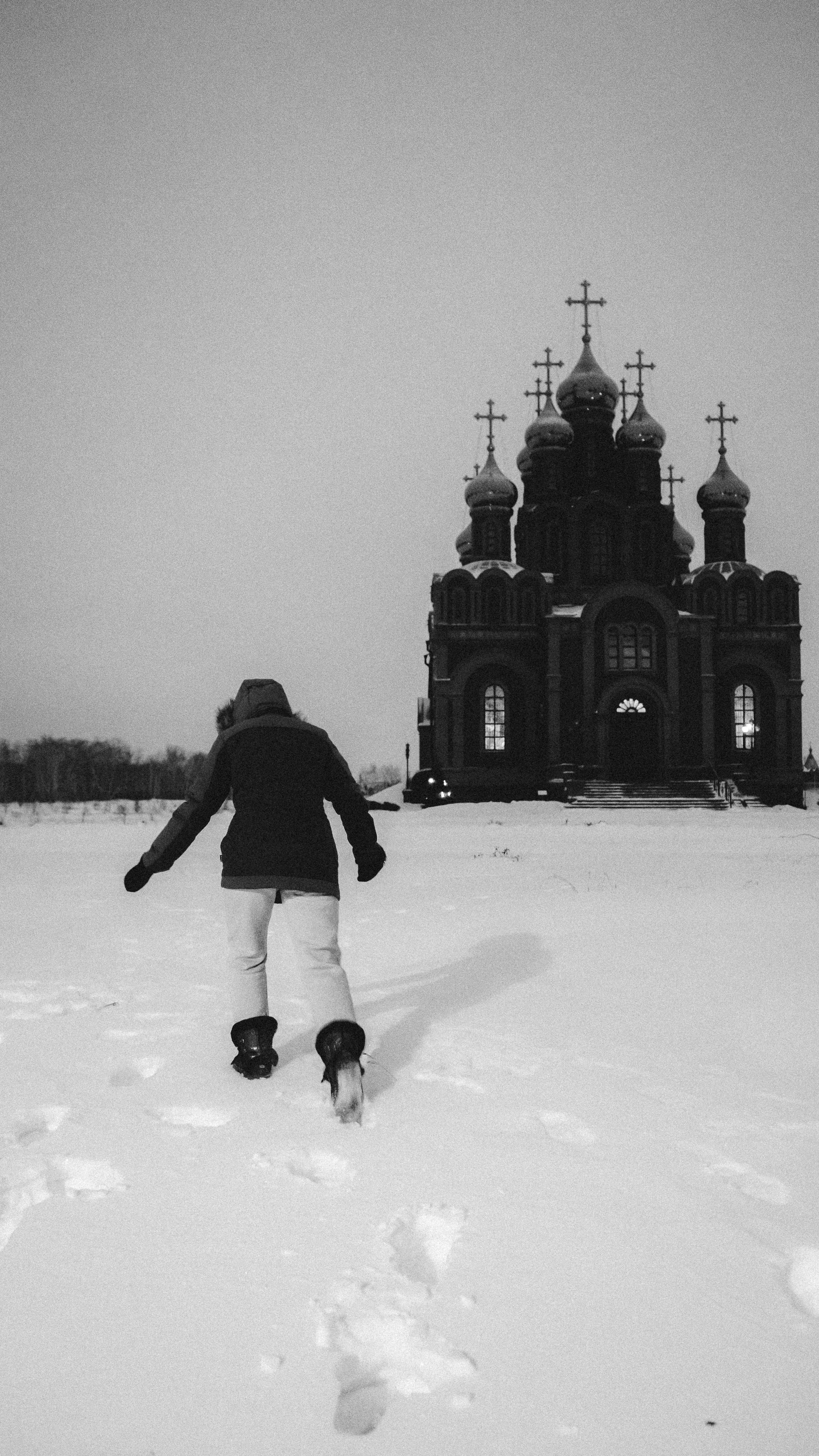 Footsteps Toward the Onion-Domed Cathedral in a Quiet Snowfield