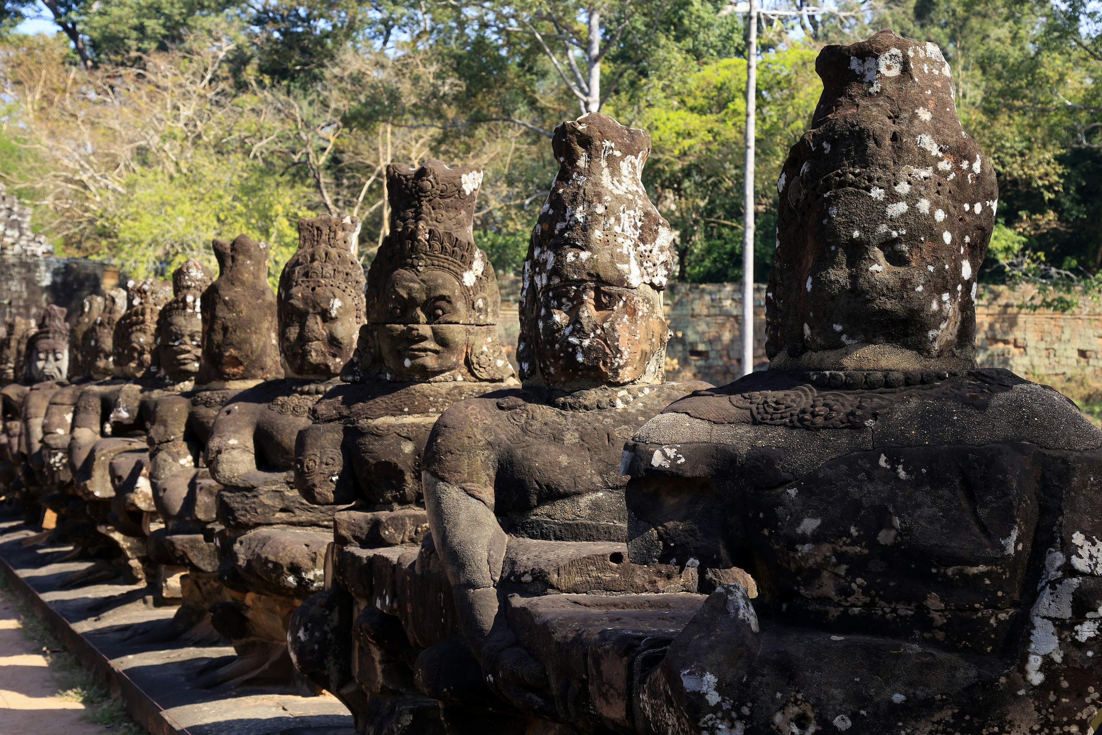 A row of statues sitting next to each other photo – Free Angkor wat ...