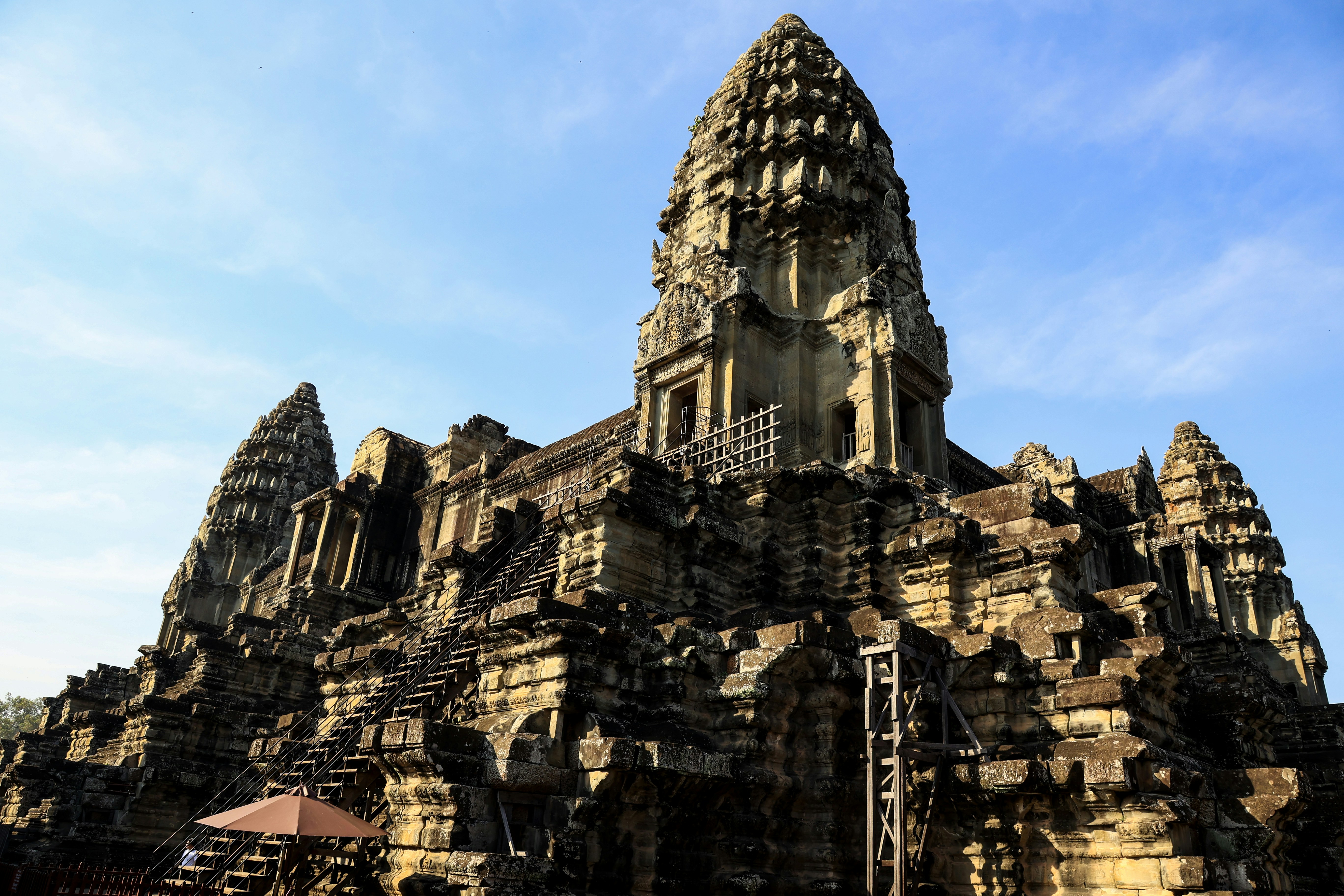 A very tall building with a clock on it's face photo – Free Angkor wat ...