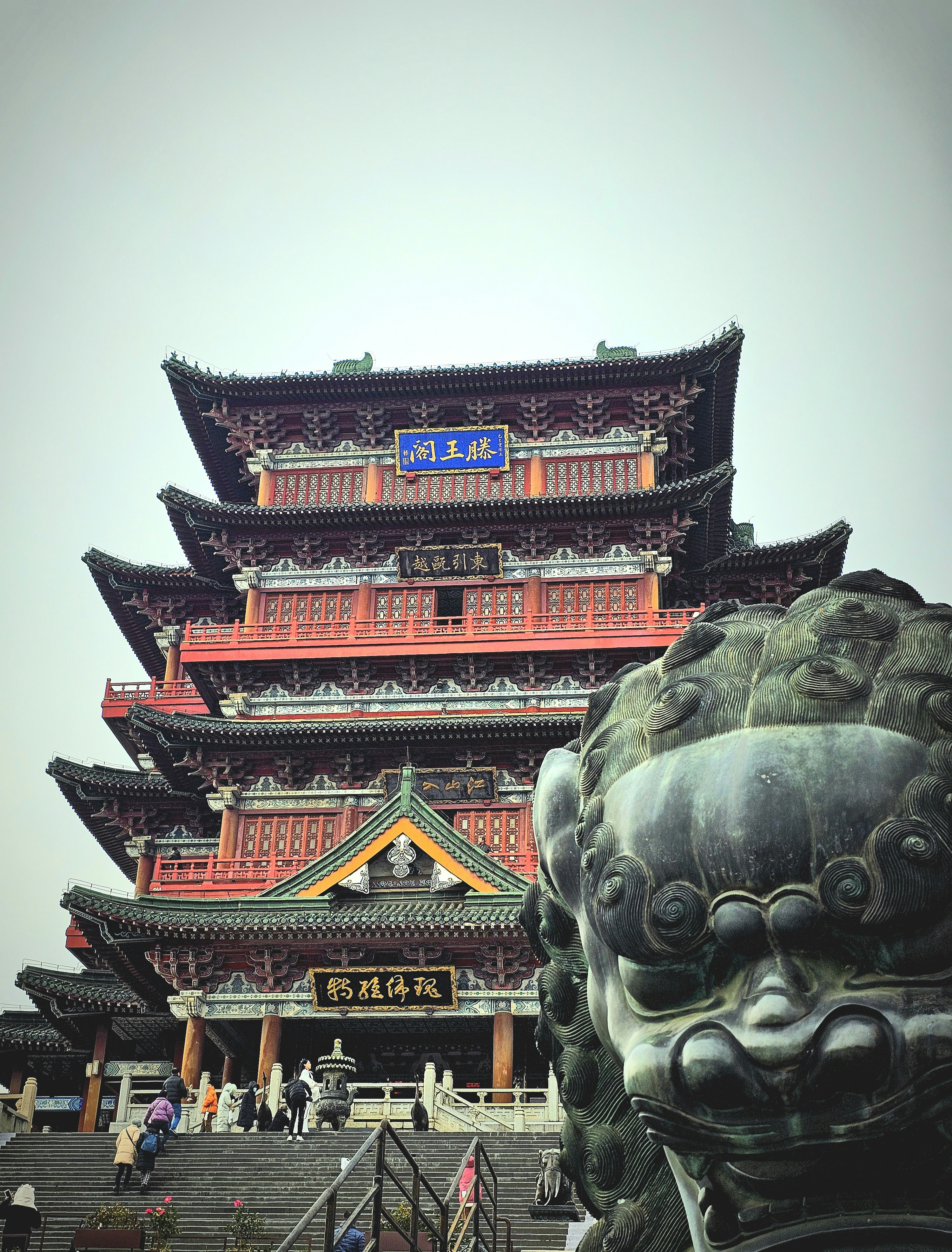 A tall building with a dragon statue in front of it photo – Free China ...