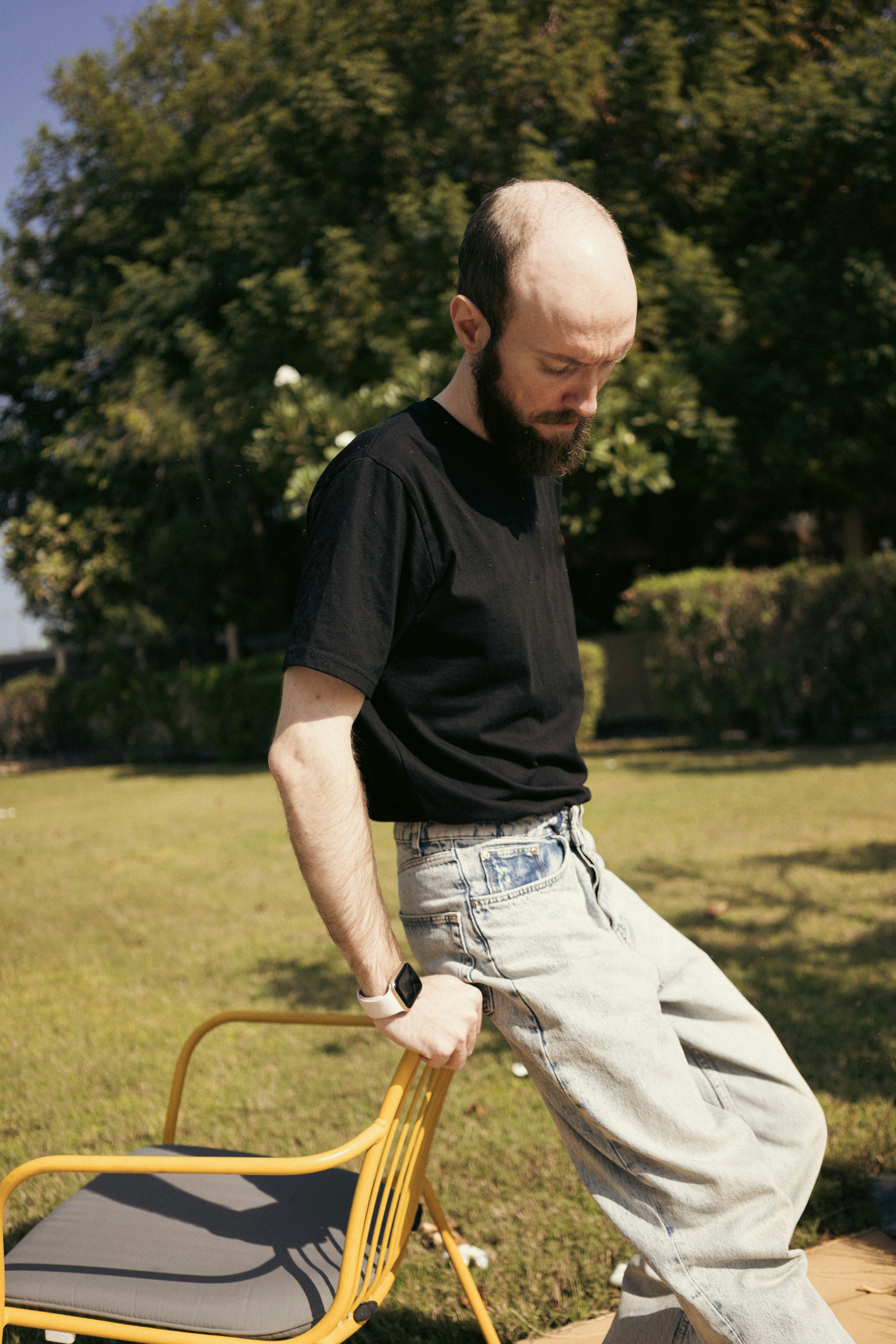Beard, Black Tee, and a Yellow Chair: a Quiet Park Portrait in Afternoon Light
