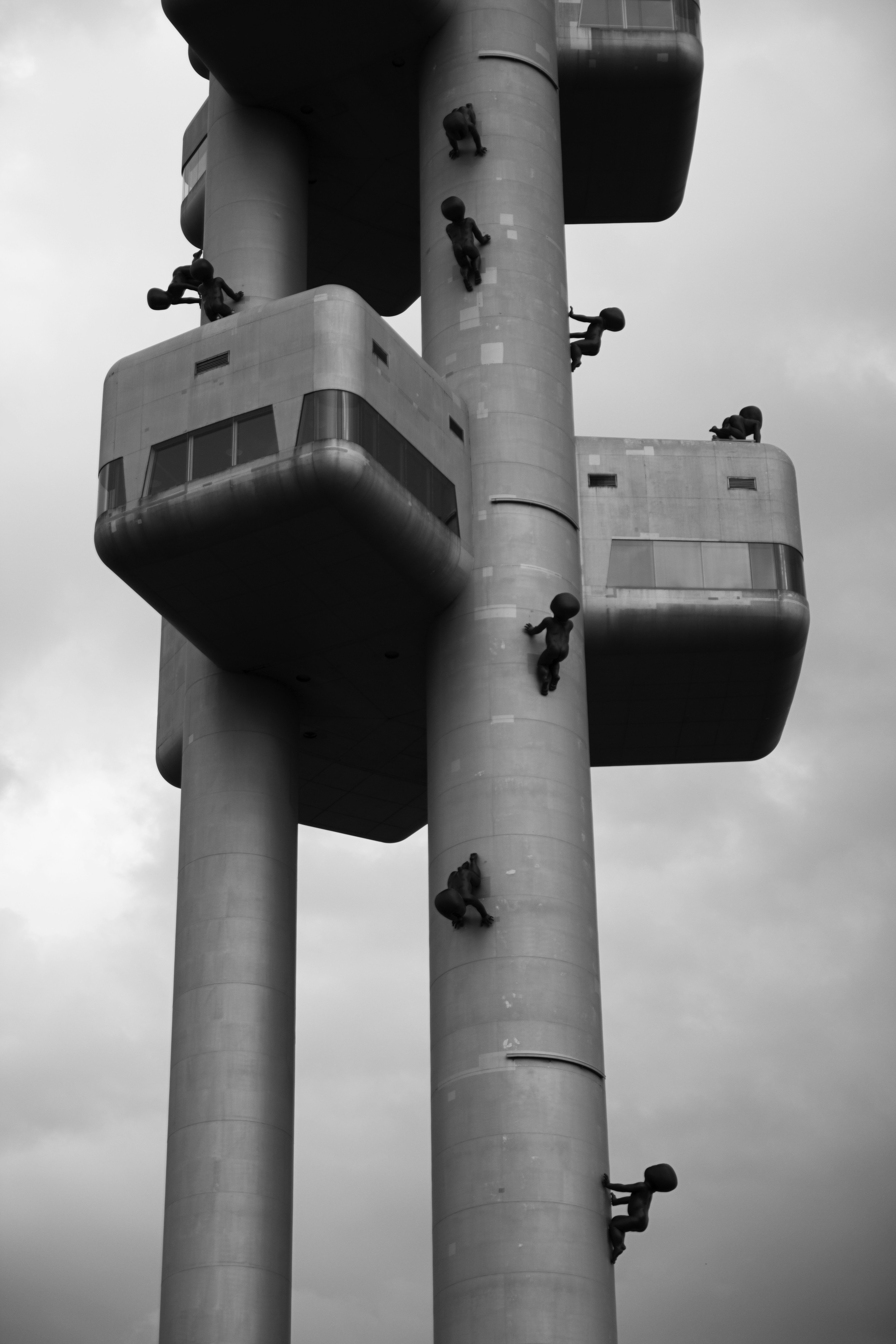 Climbers on the Skyward Pillars: A Mono Portrait of Industrial Ascent