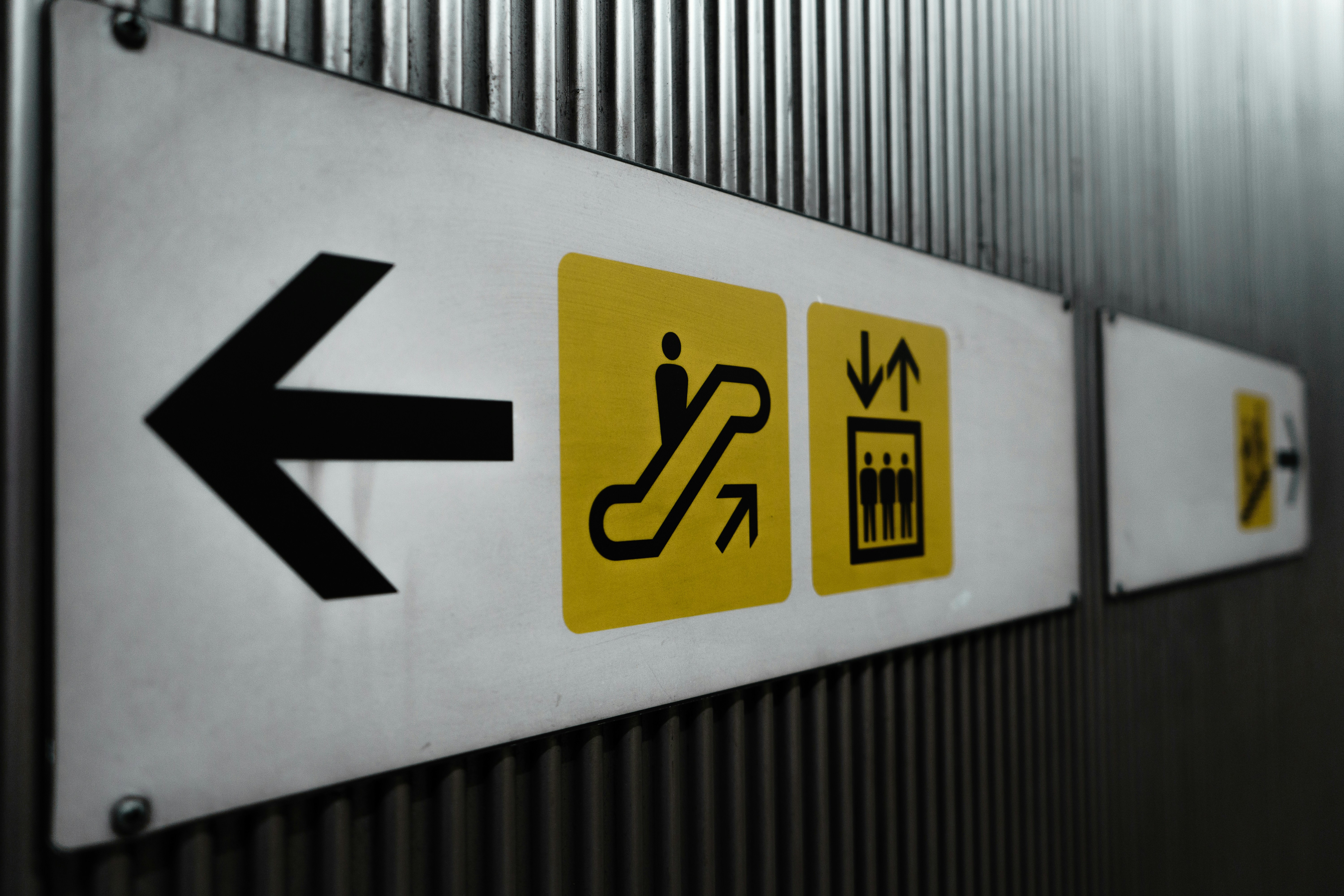 Minami-Nagareyama Station | a close up of a sign on a wall