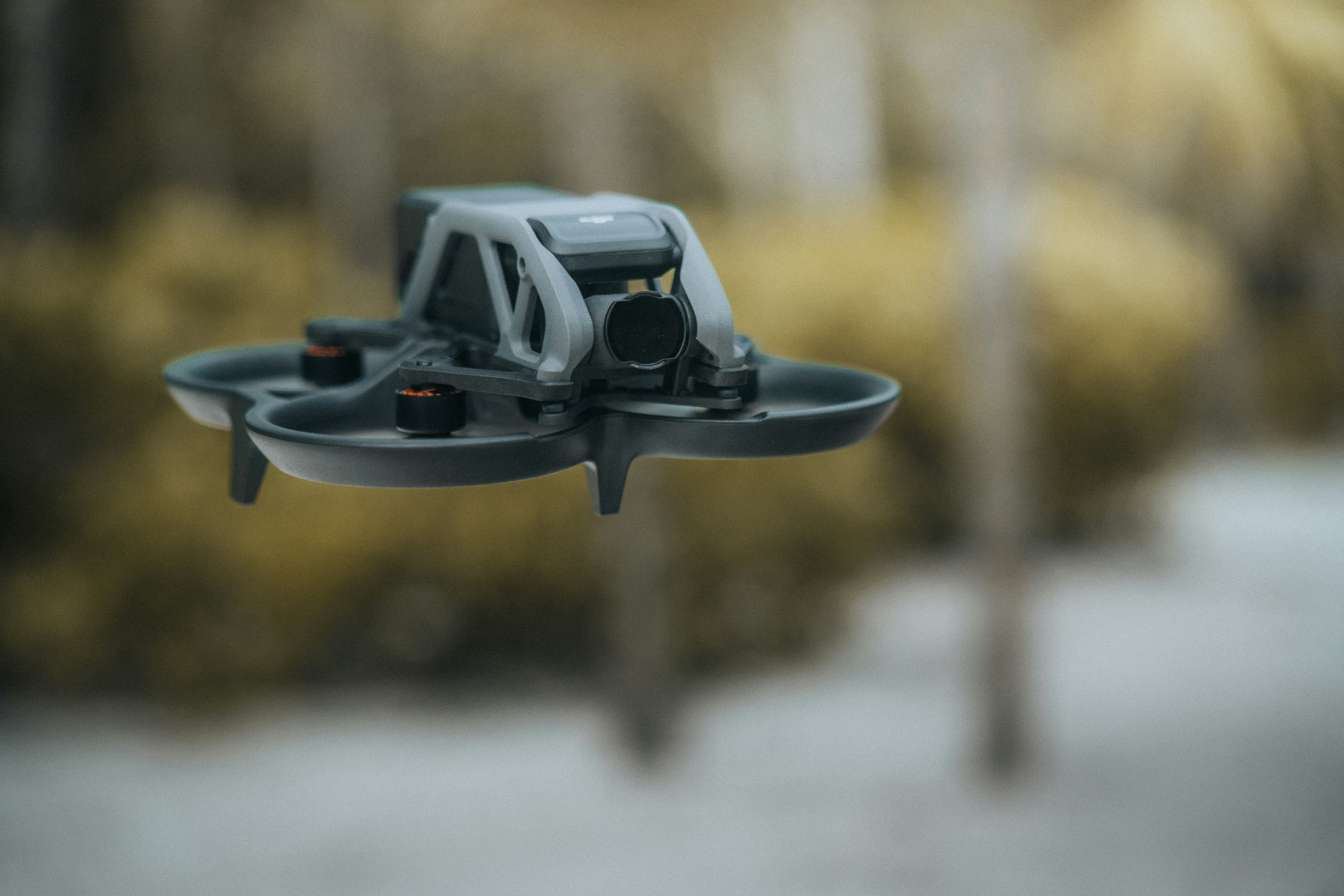 Close-Up Hover: Micro Drone Frozen in Autumn Air