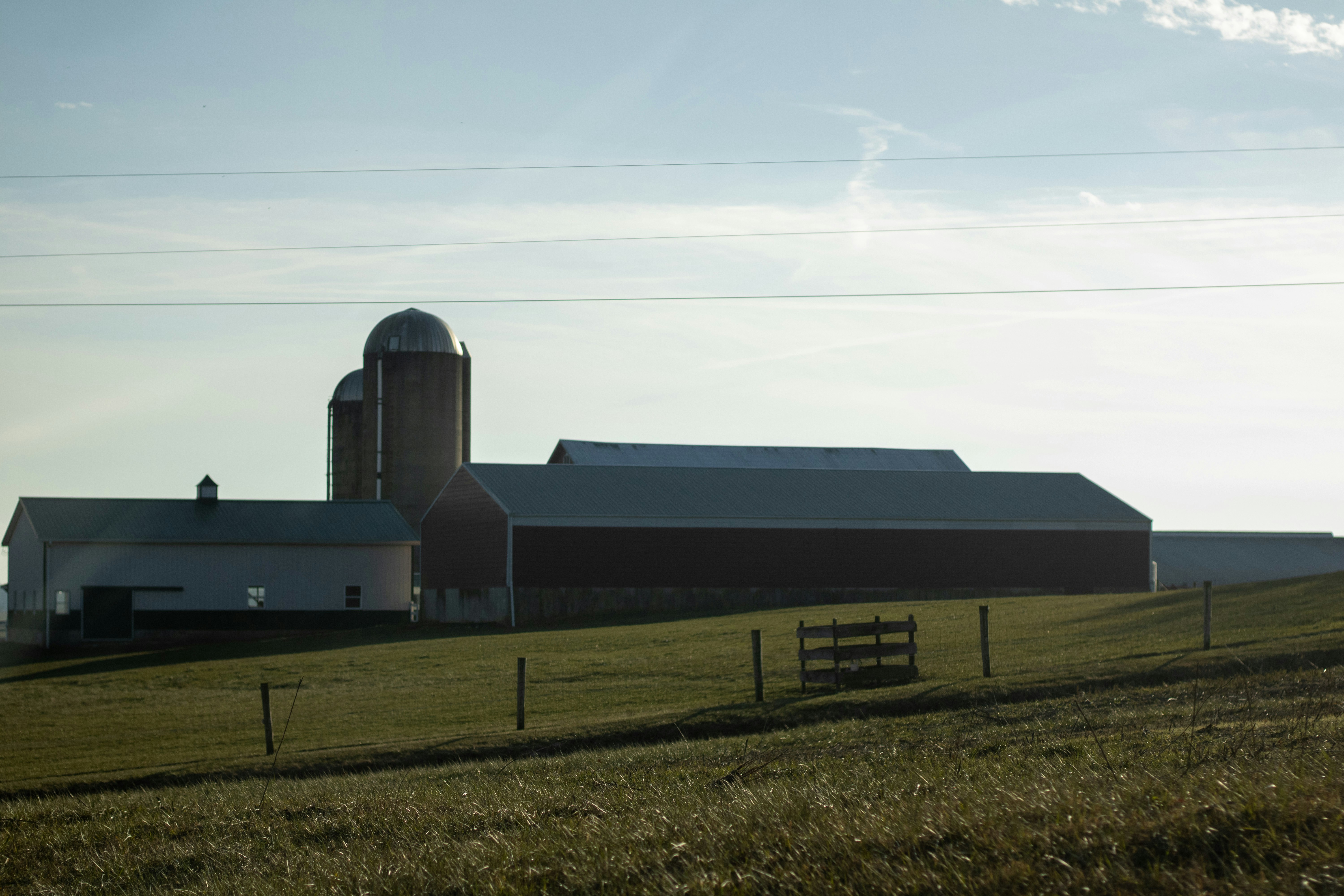 A farm with a barn and silo in the background photo – Free Oh Image on ...