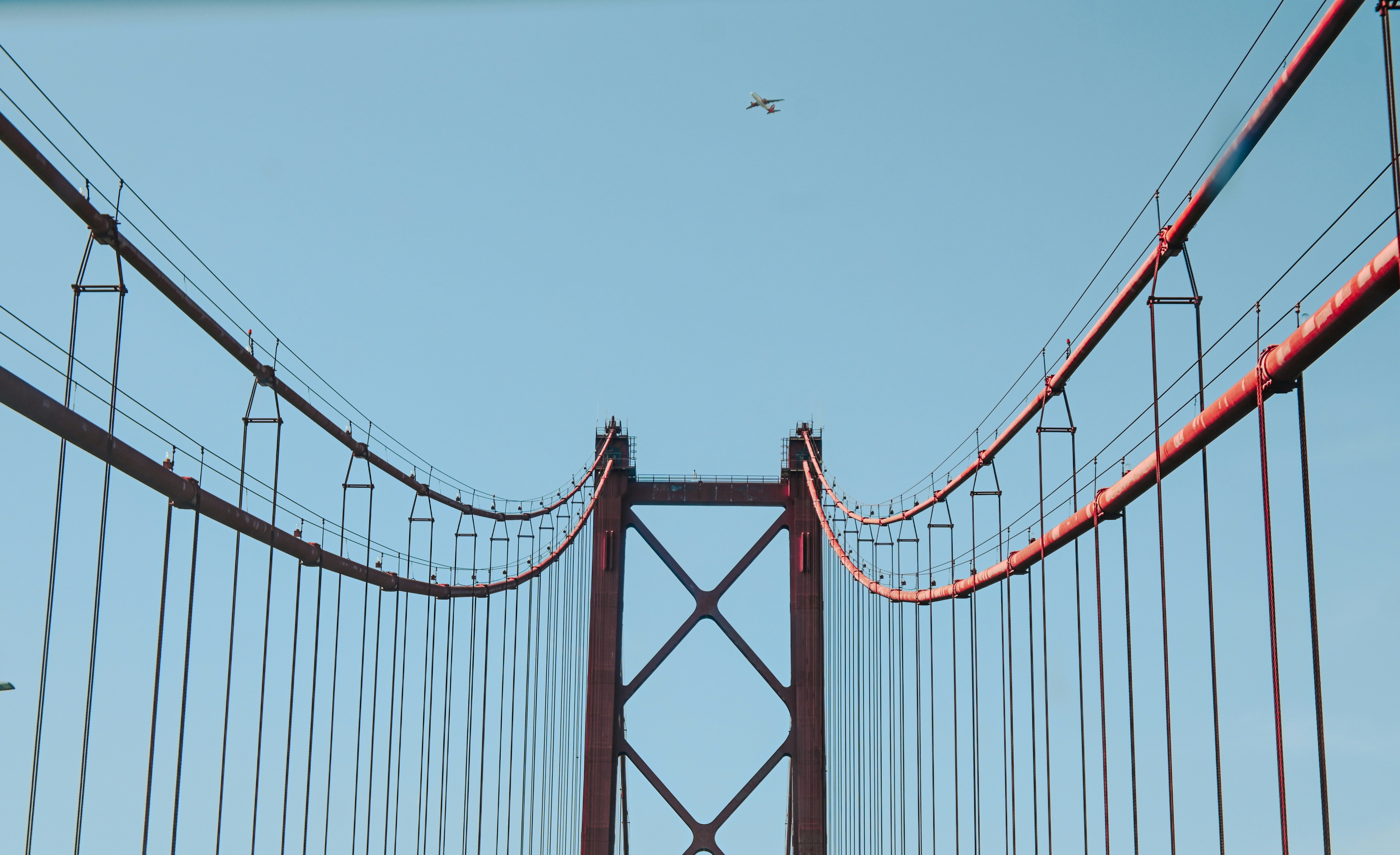 Cabled Convergence: Center Tower Framing a Cerulean Sky