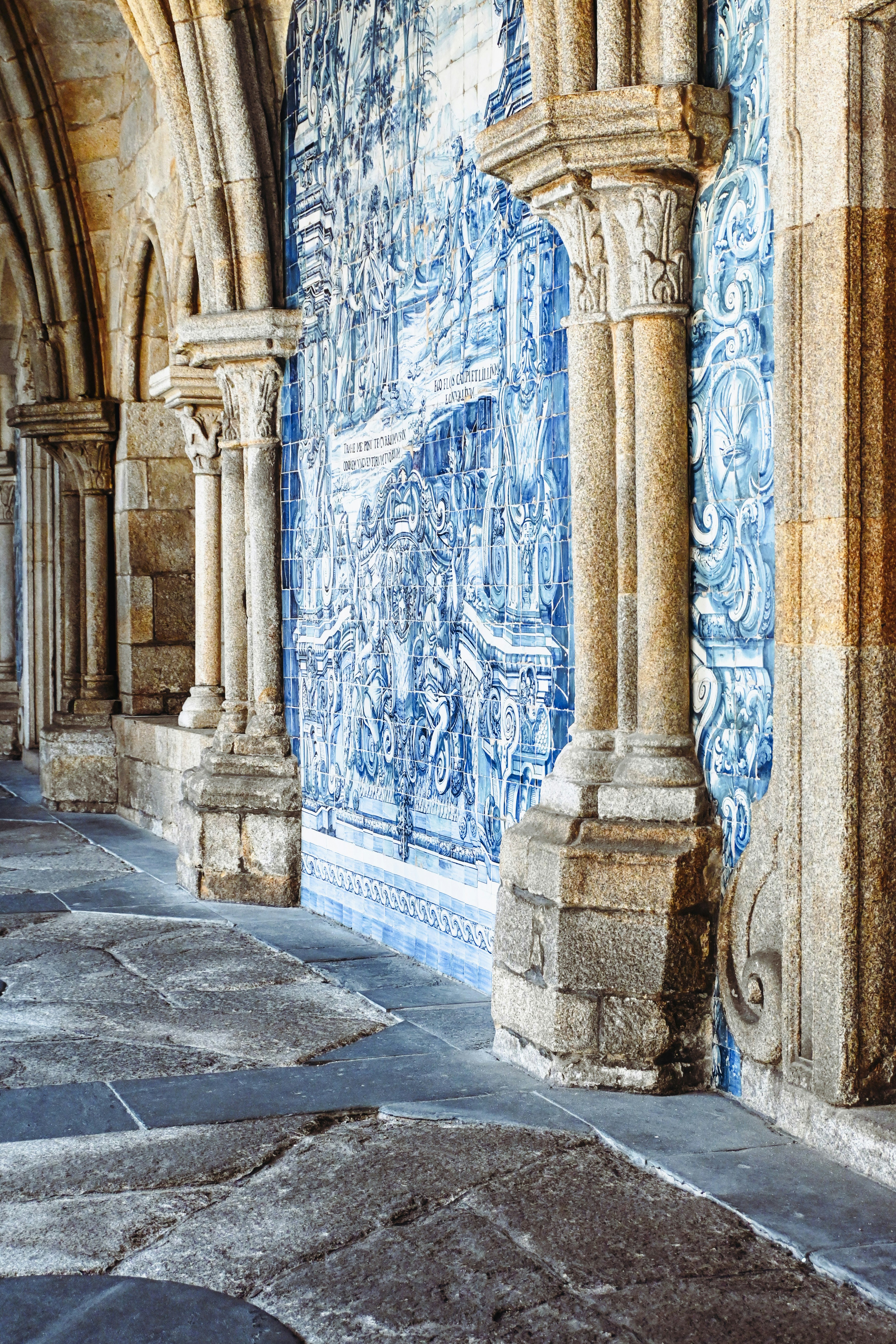A blue and white wall with columns and arches photo – Free Building ...