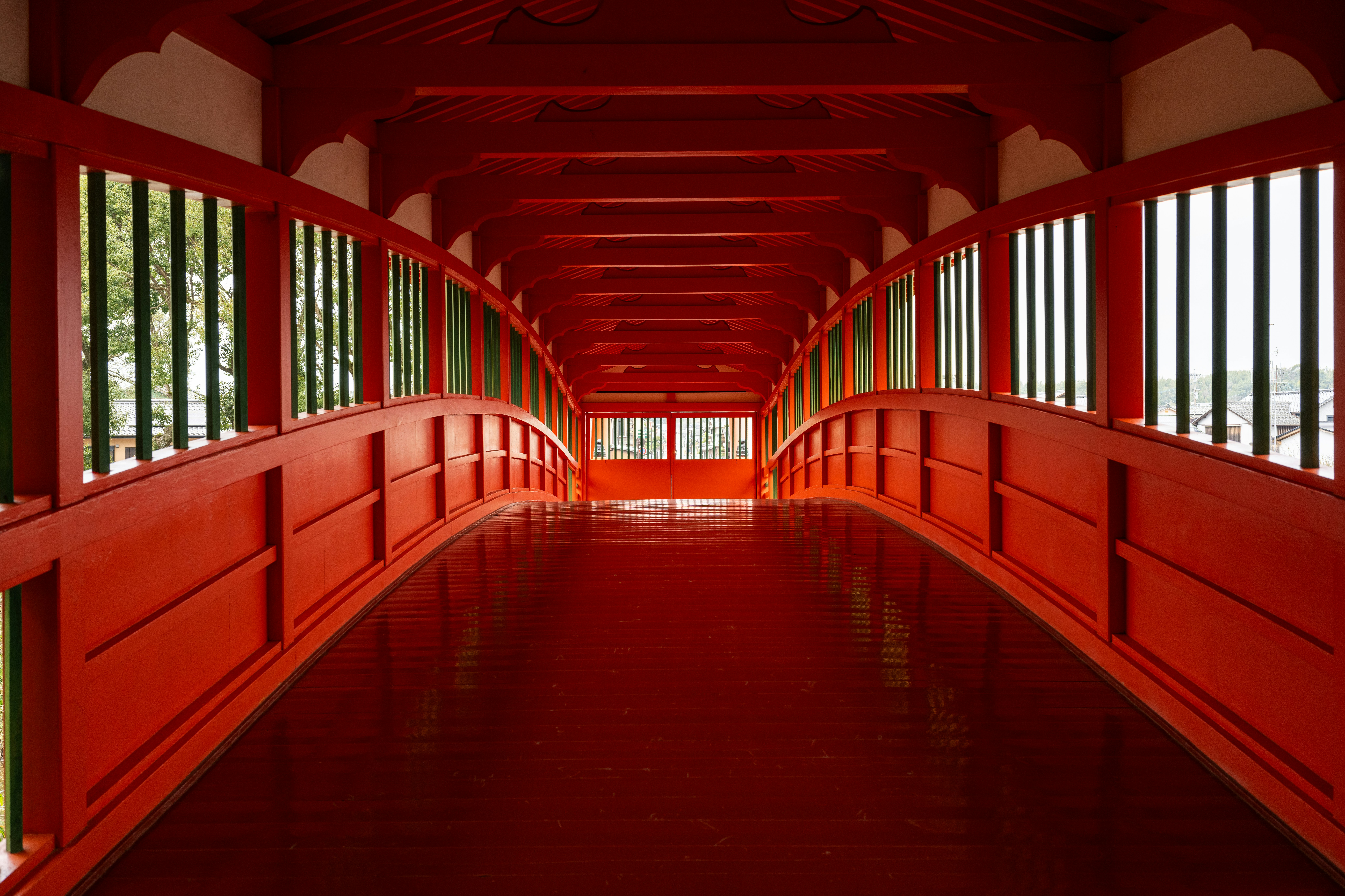 A long red bridge with a red floor and railings photo – Free Building ...