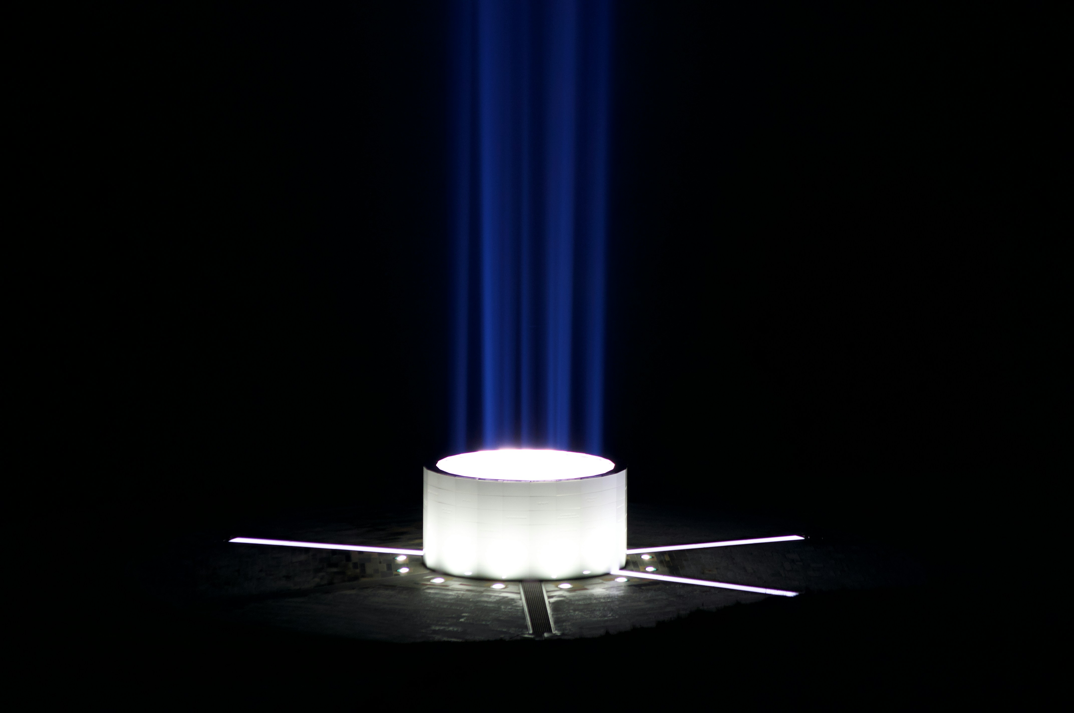 A lit object in the dark with blue light coming from it photo – Free ...