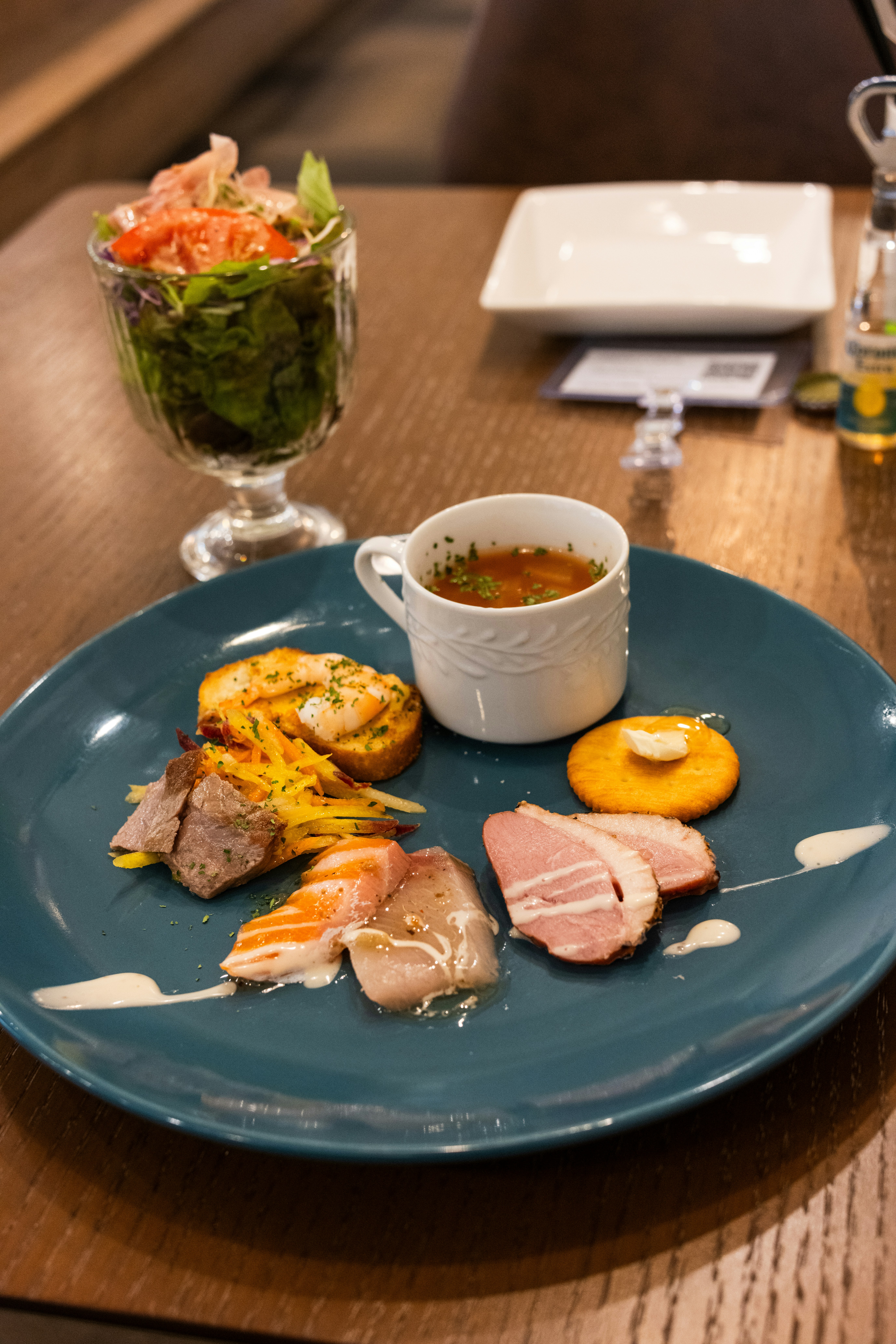 Curated Plates: A Blue Rimmed Feast with Greens and Soup