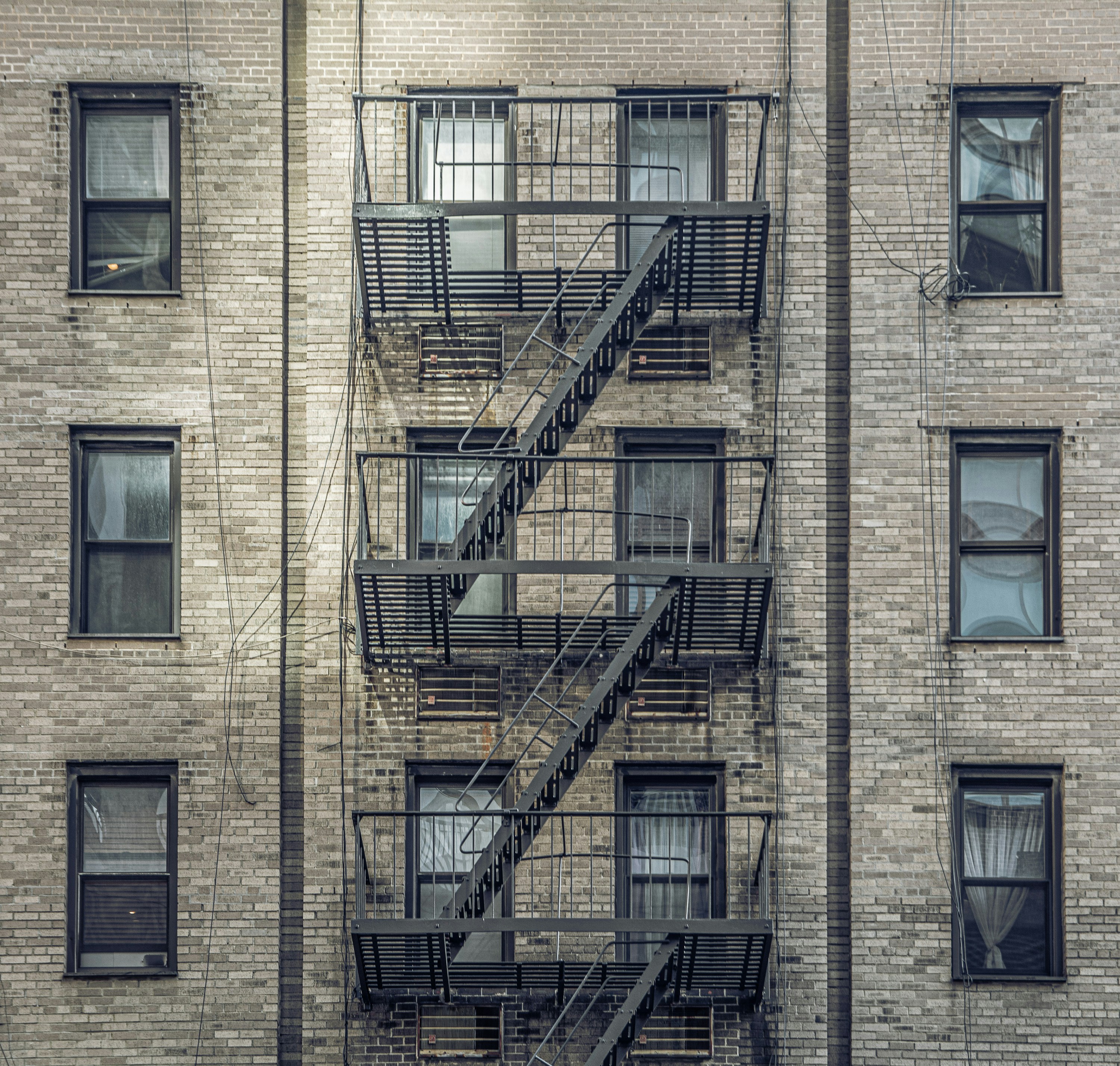 A fire escape on the side of a building photo – Free Building Image on ...