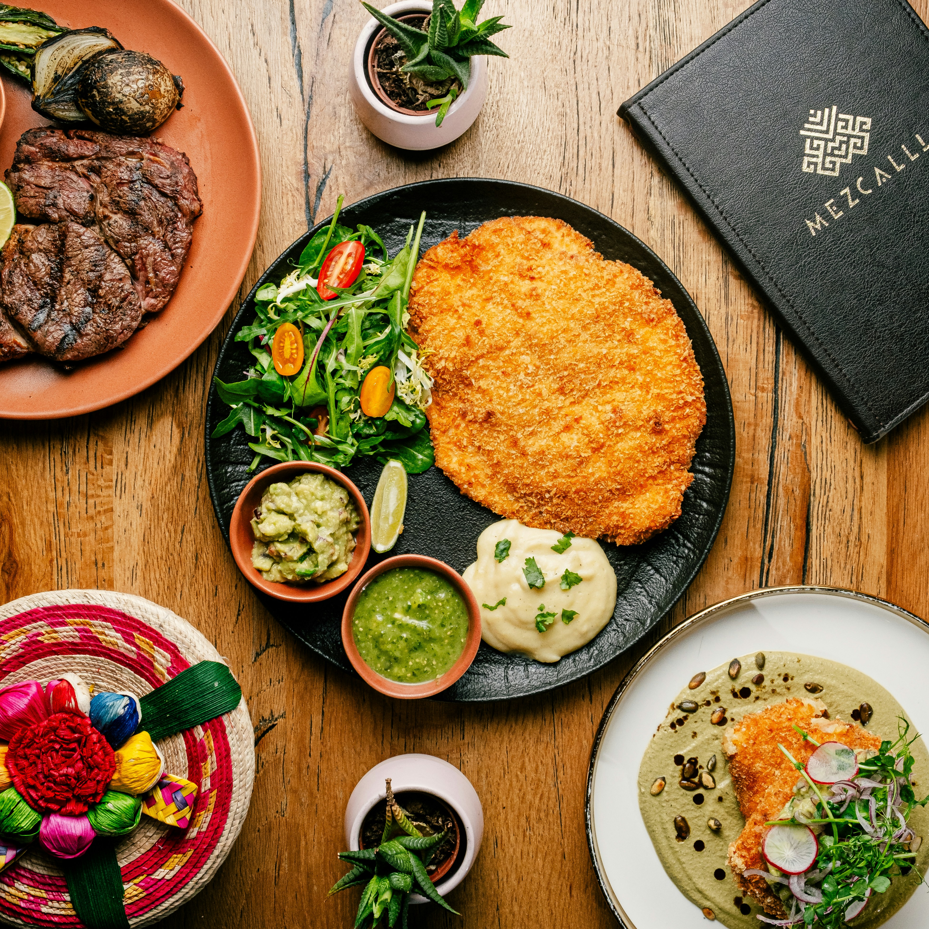 A wooden table topped with plates of food photo – Free Food Image on ...